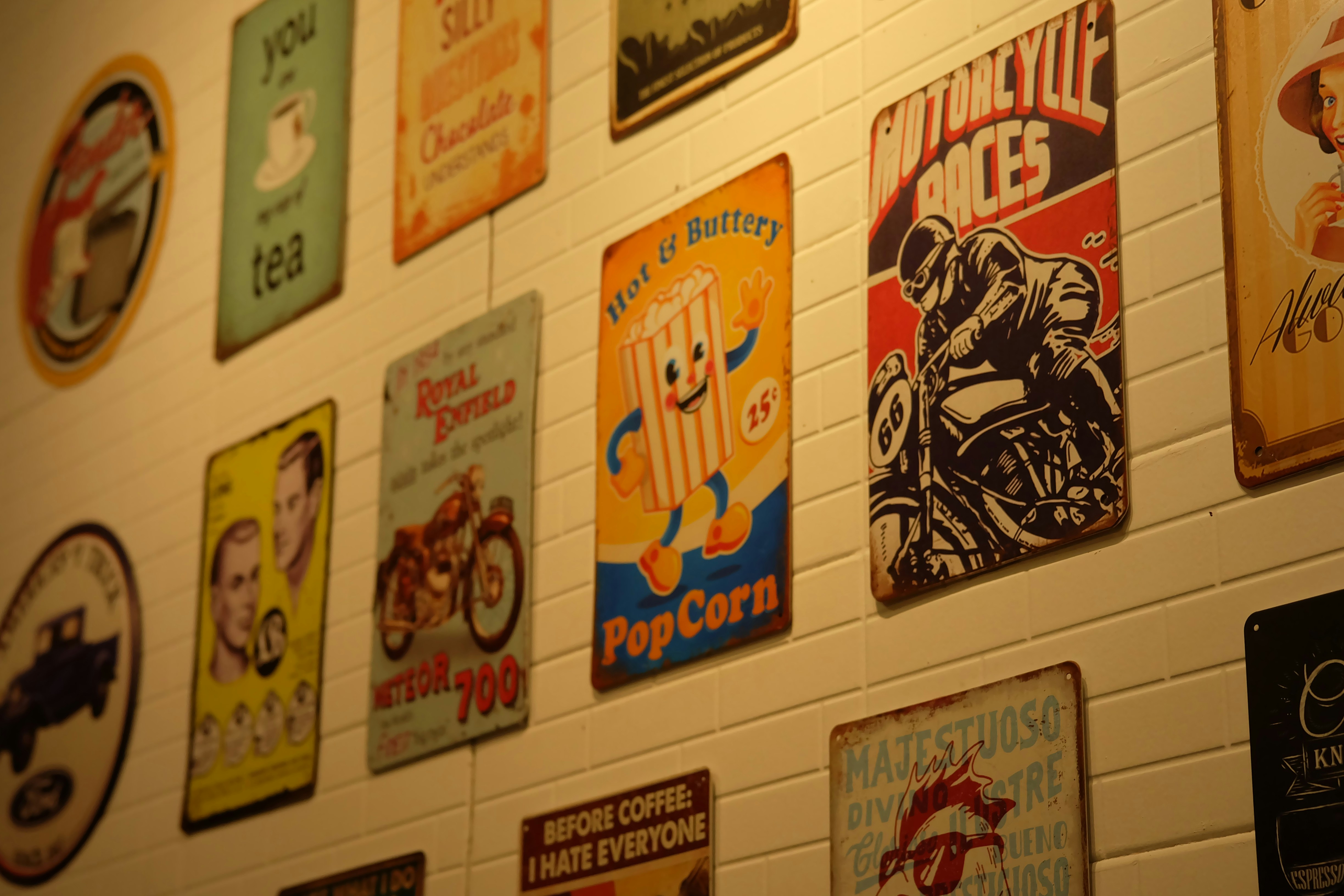 A wall with a bunch of posters on it photo – Free Poster Image on Unsplash