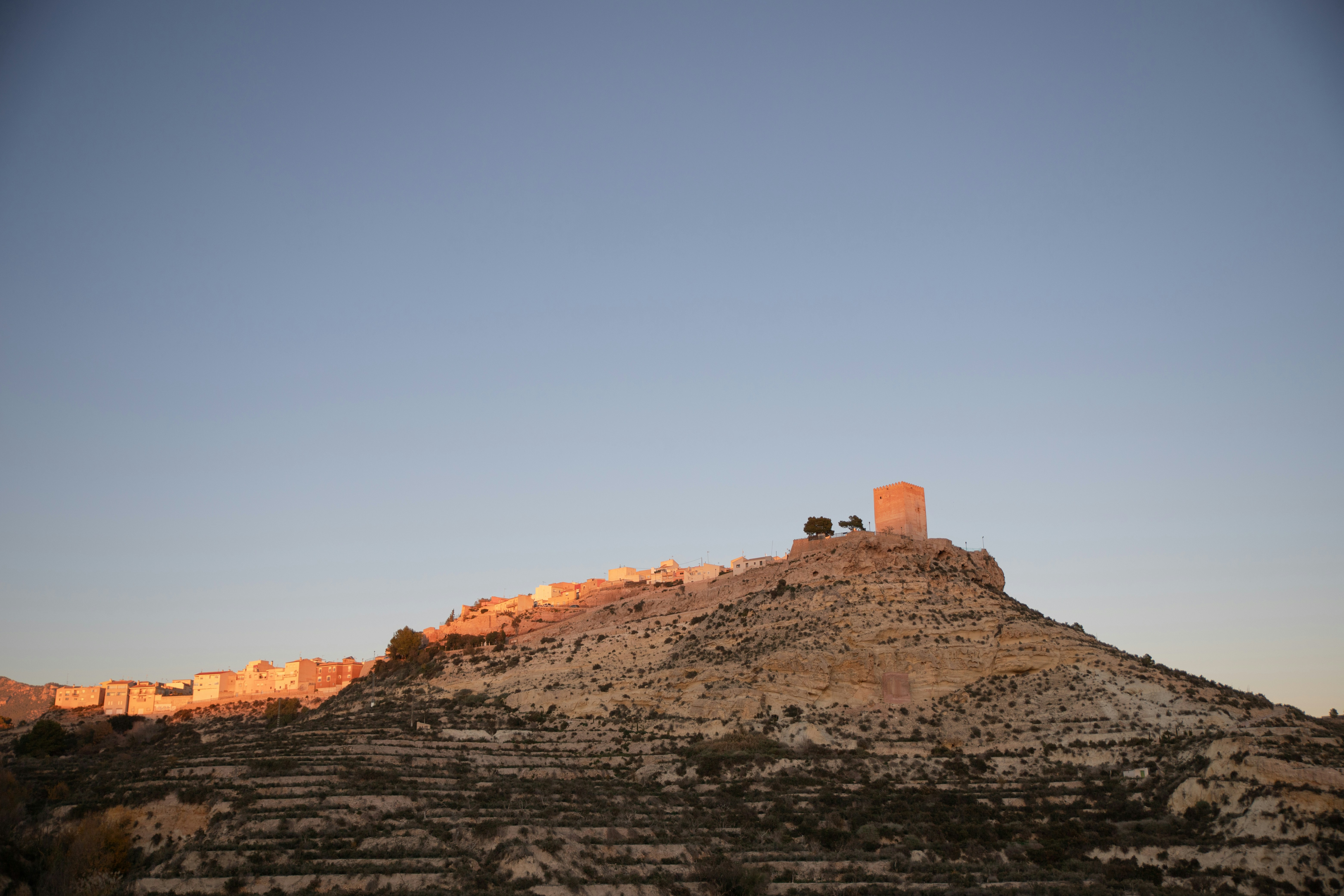 A mountain with a castle on top of it photo – Free Aledo Image on Unsplash
