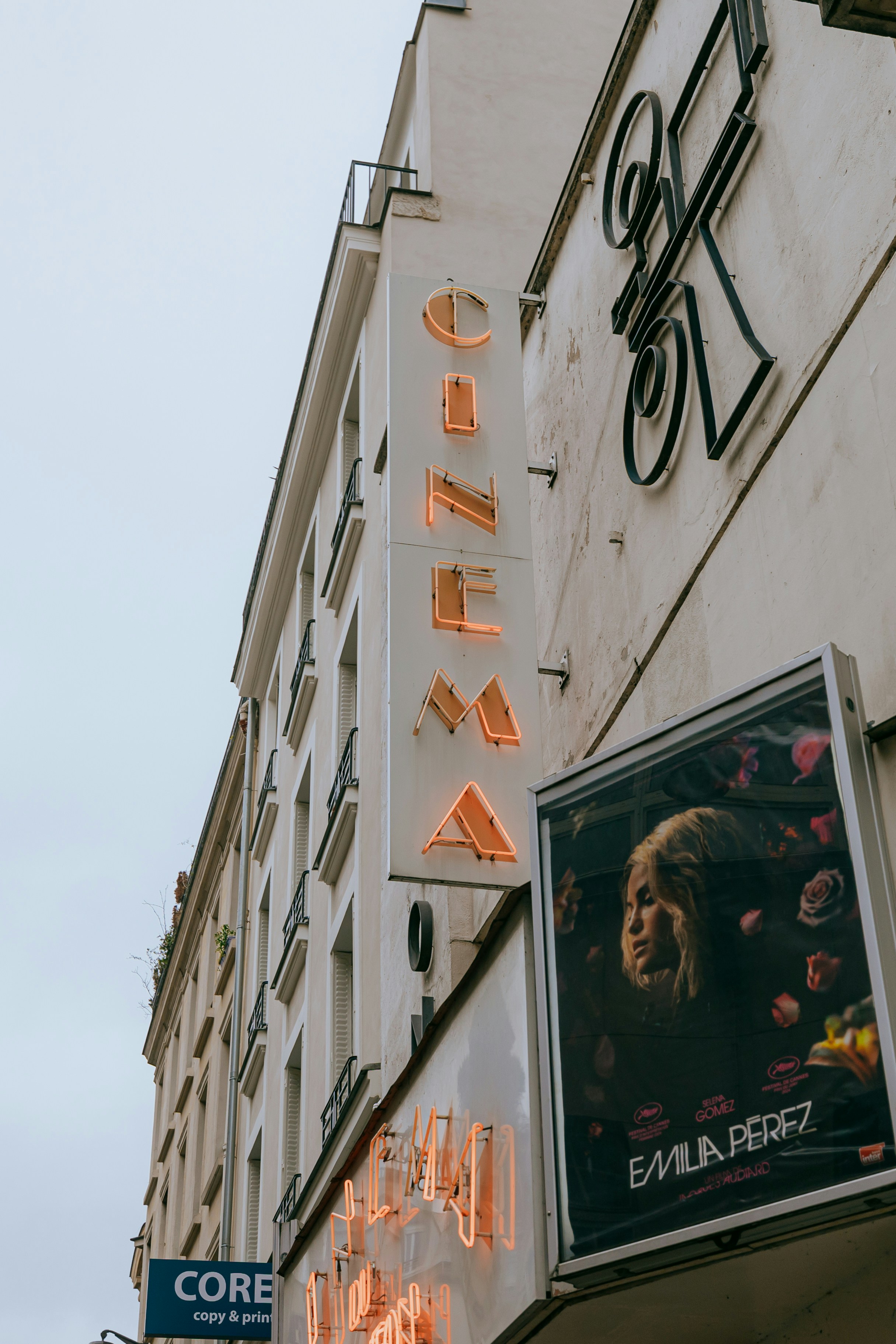 Neon Letters on a Parisian Facade