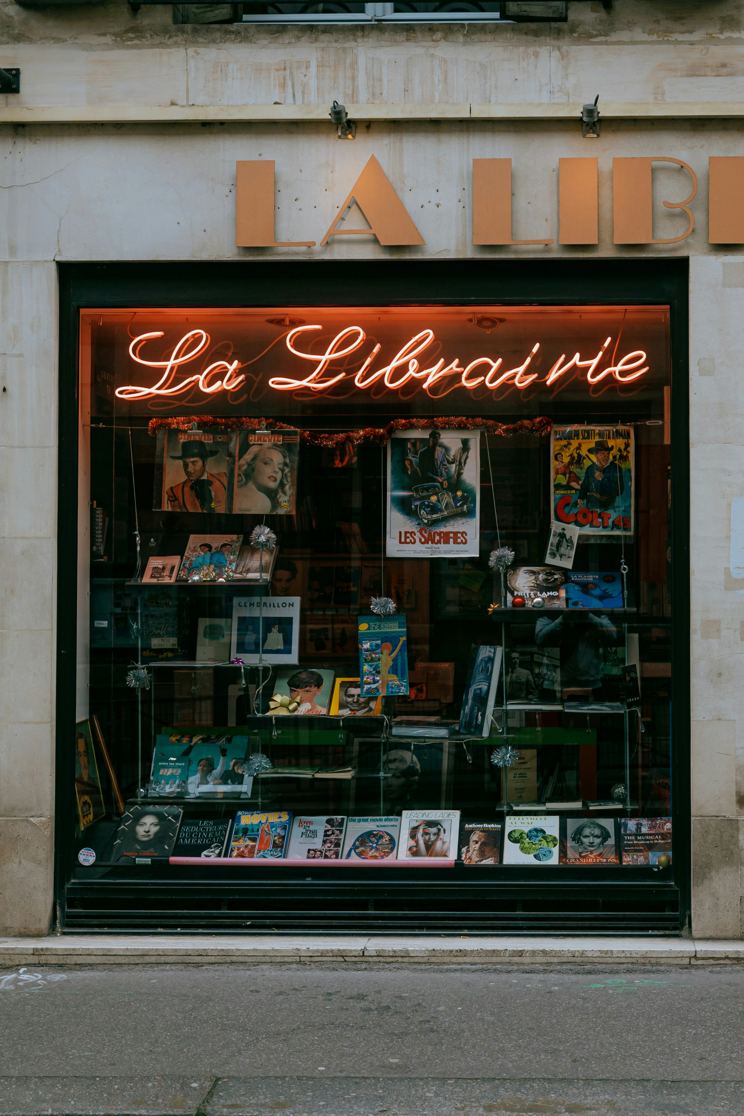 Neon Sign Over a Vintage Film Store Window