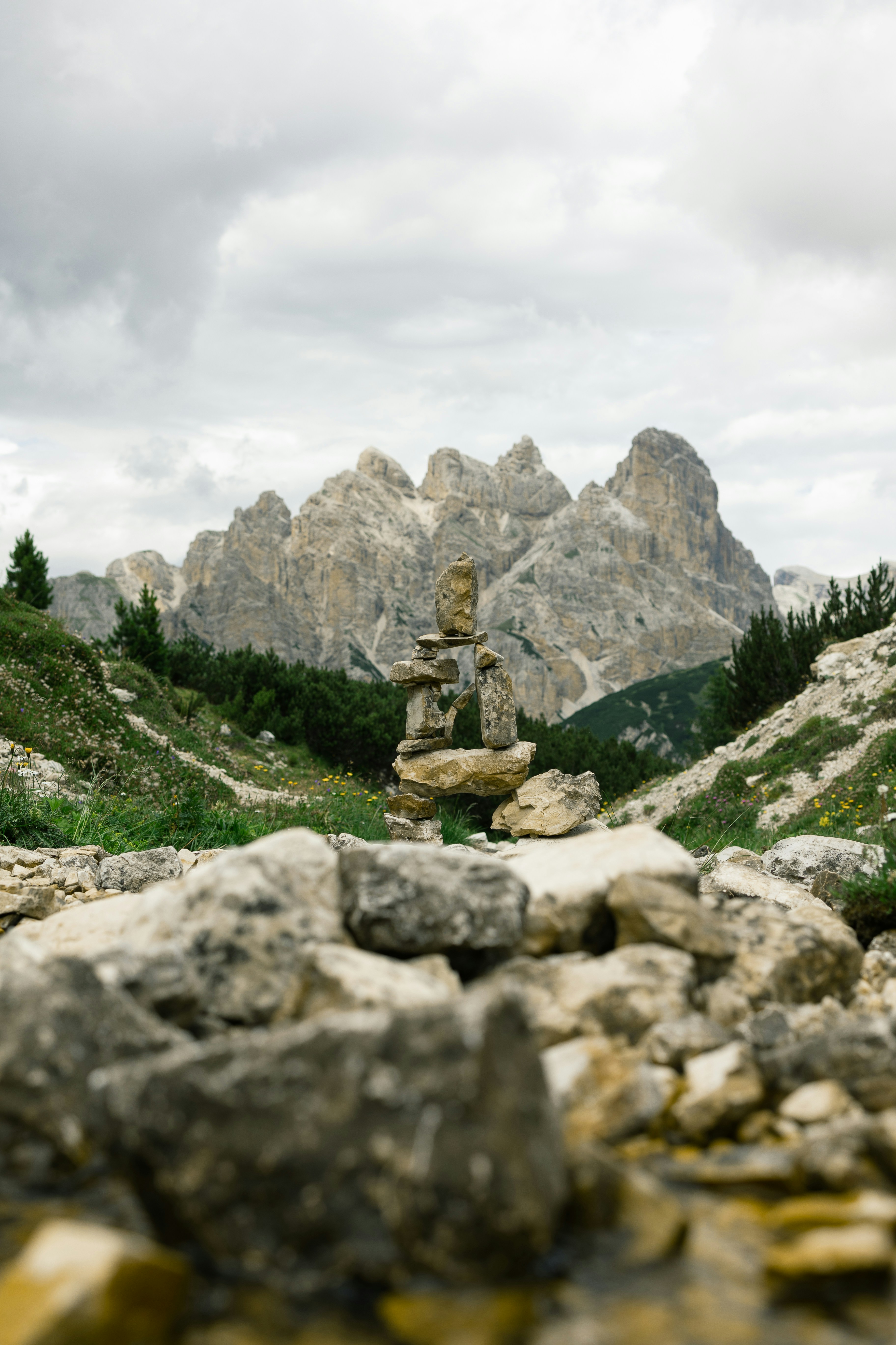 A rock stack in the middle of a mountain range photo – Free Rock stacks ...