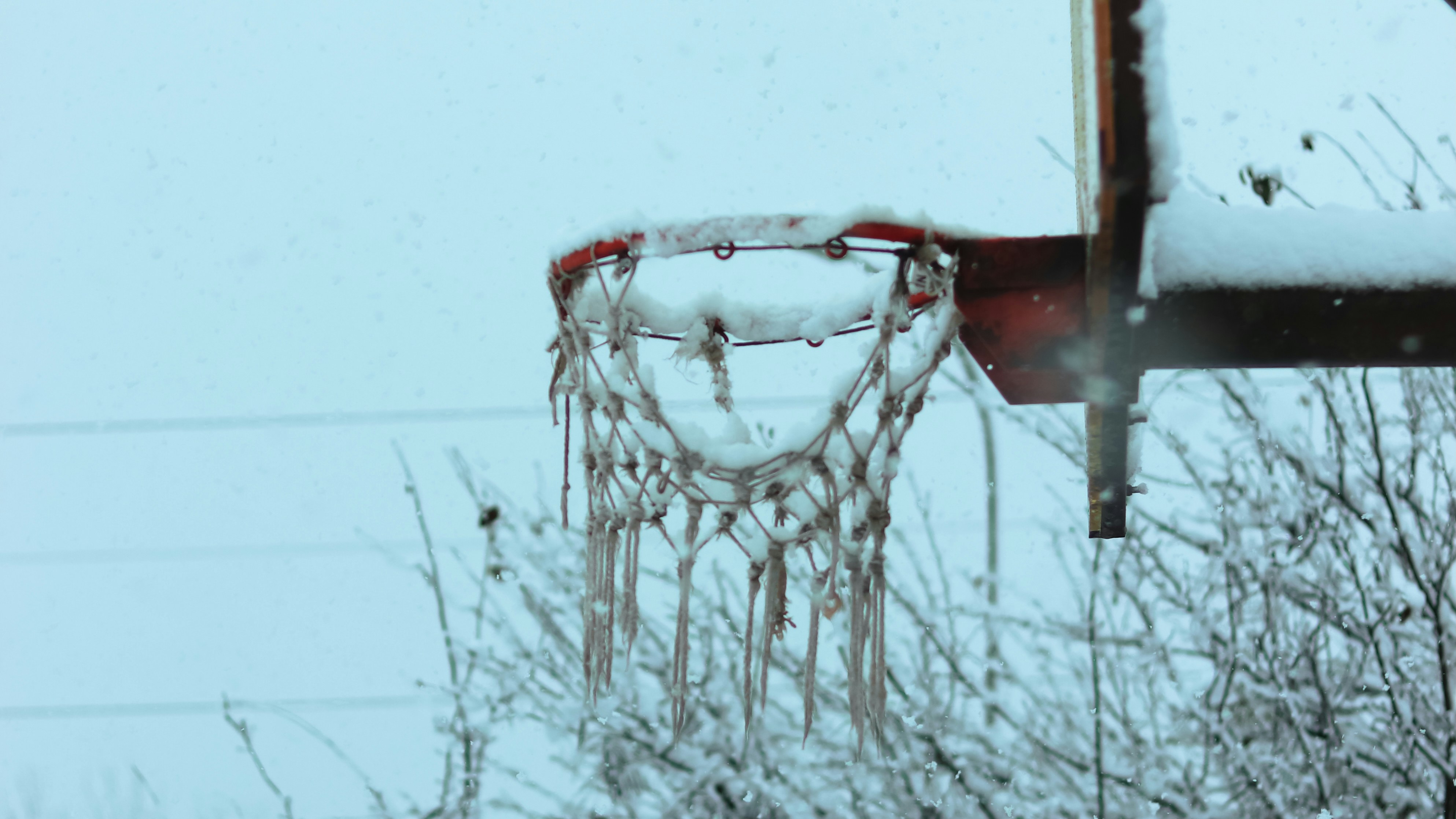 Icicle-Grasped Hoop on a Pale Winter Court