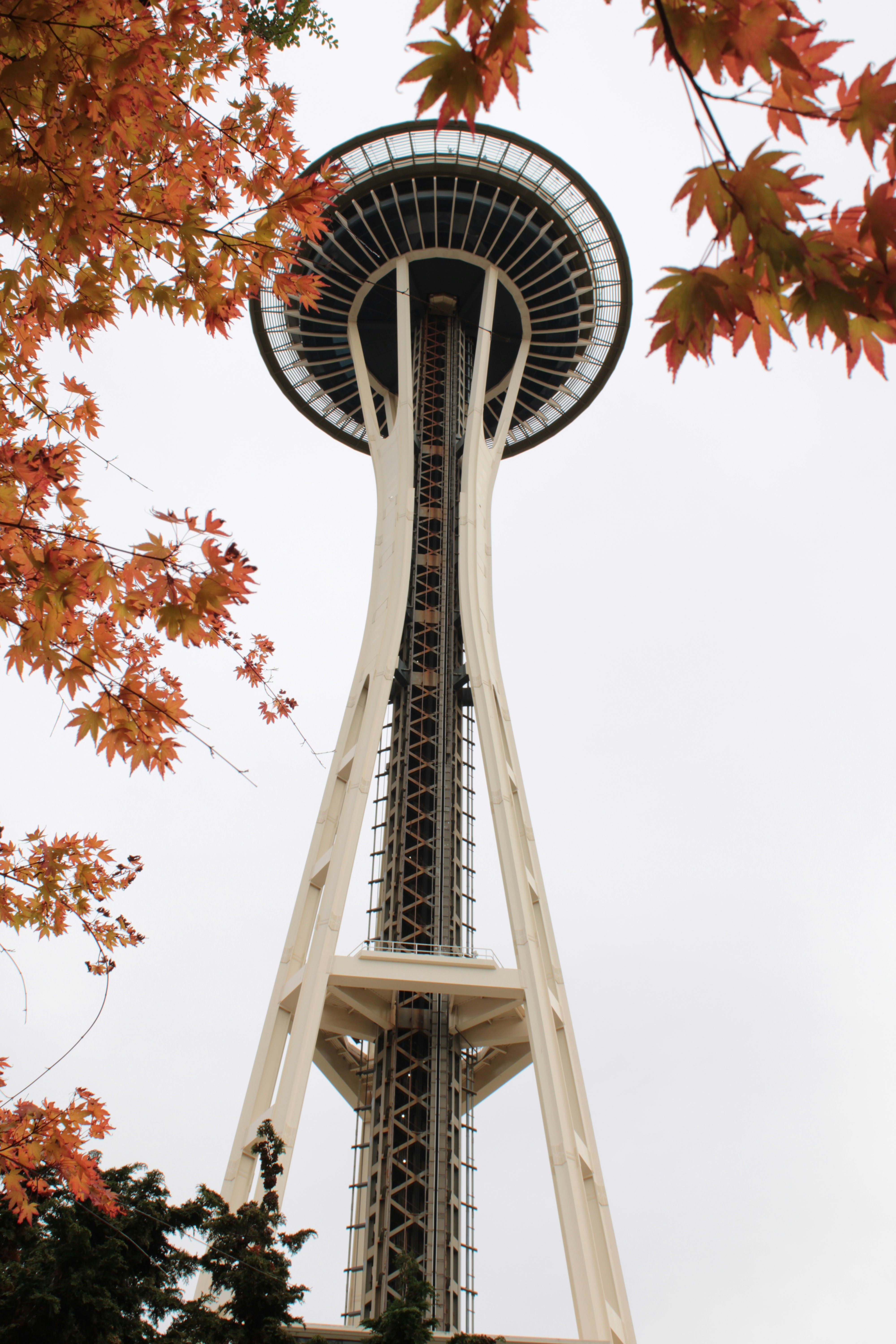 A tall tower with a sky scraper on top of it photo – Free City Image on ...