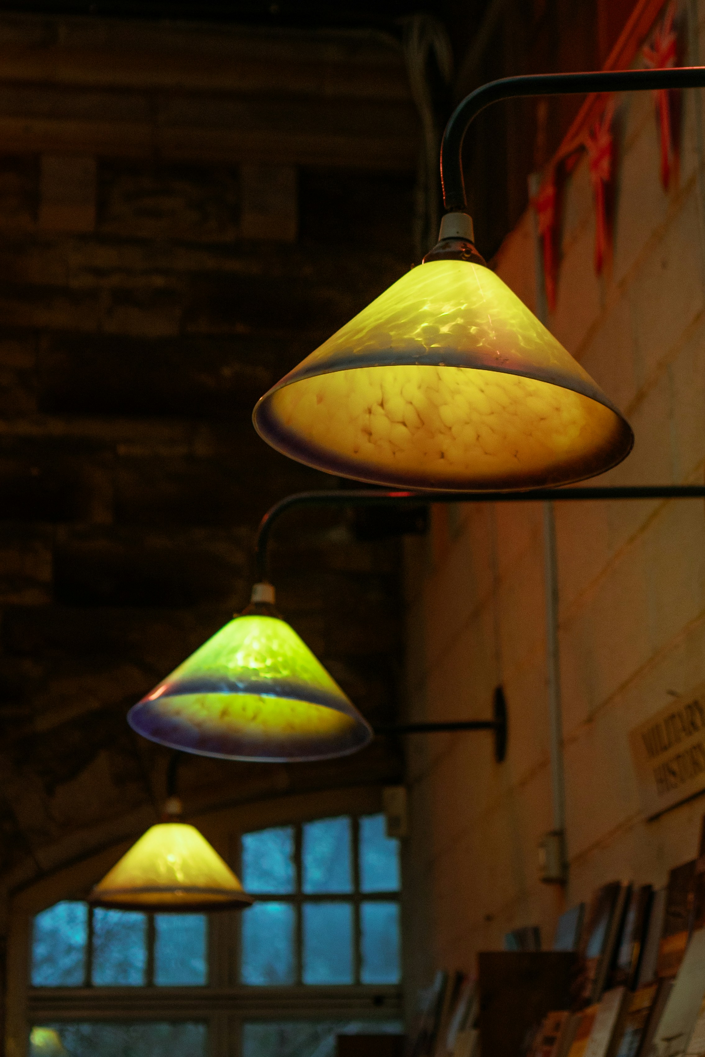 Amber Cones in a Dim Workshop: A Corridor of Industrial Warmth