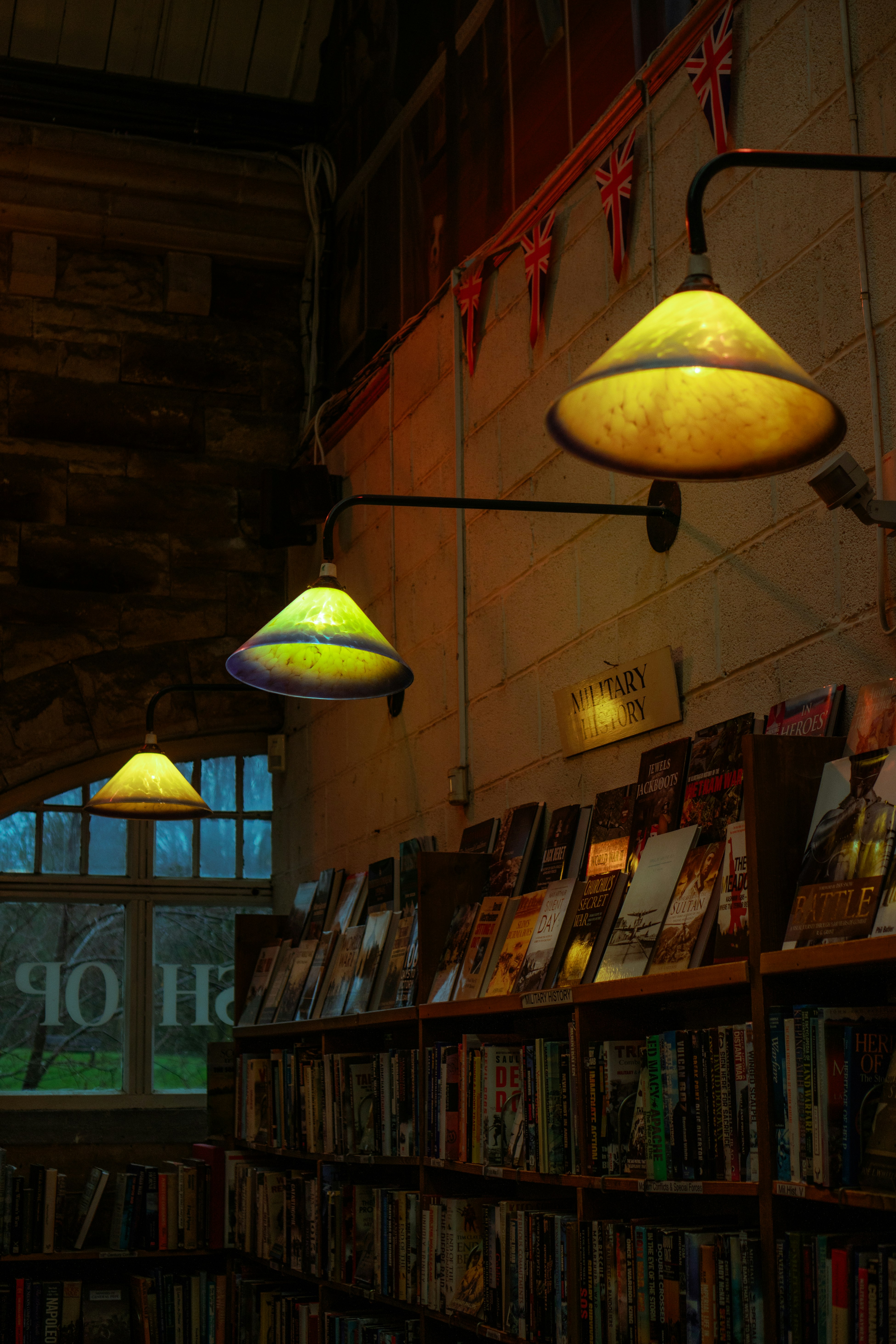 Amber Orbs Above a Quiet Library Aisle