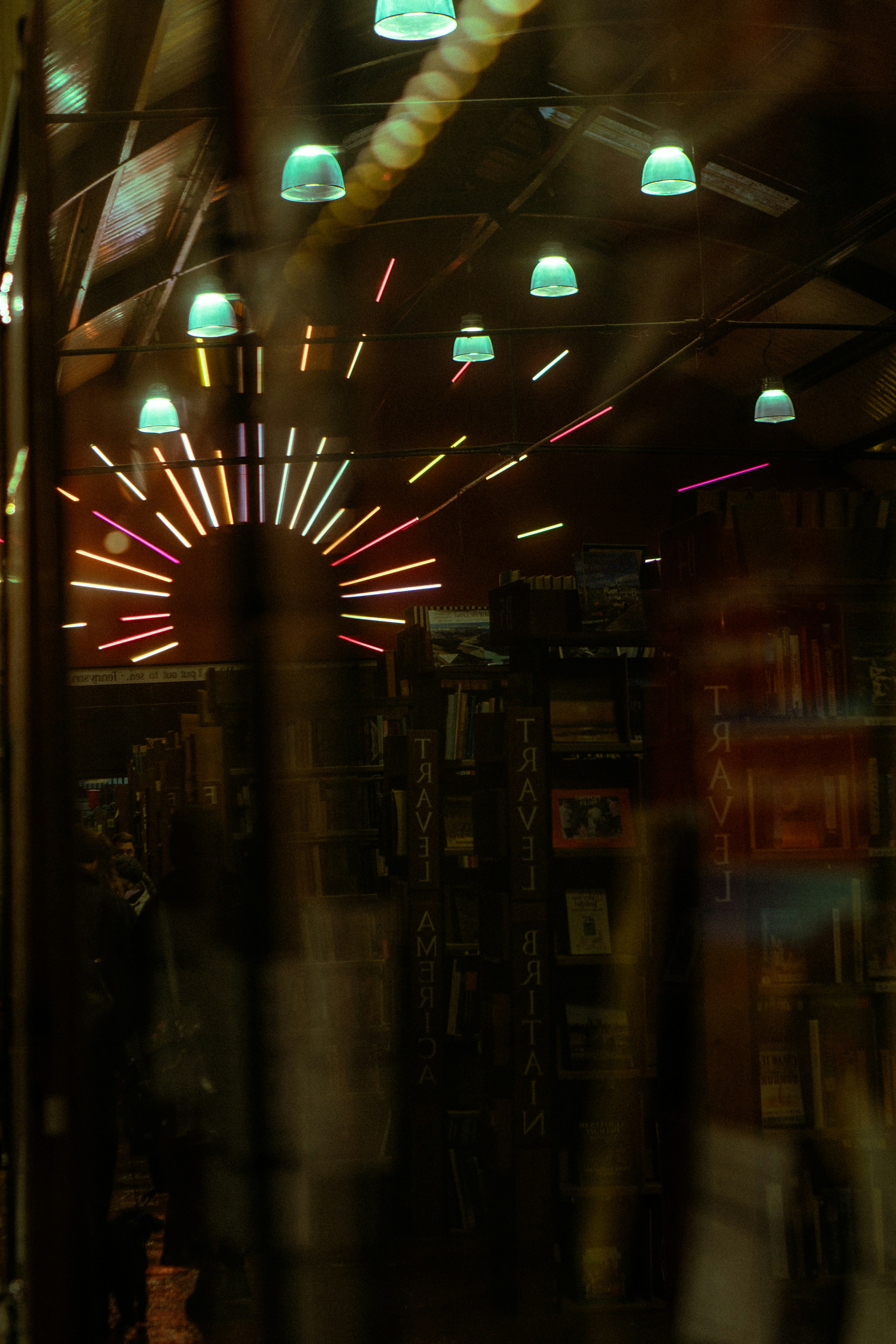 A store window with lights reflecting off the glass photo – Free ...