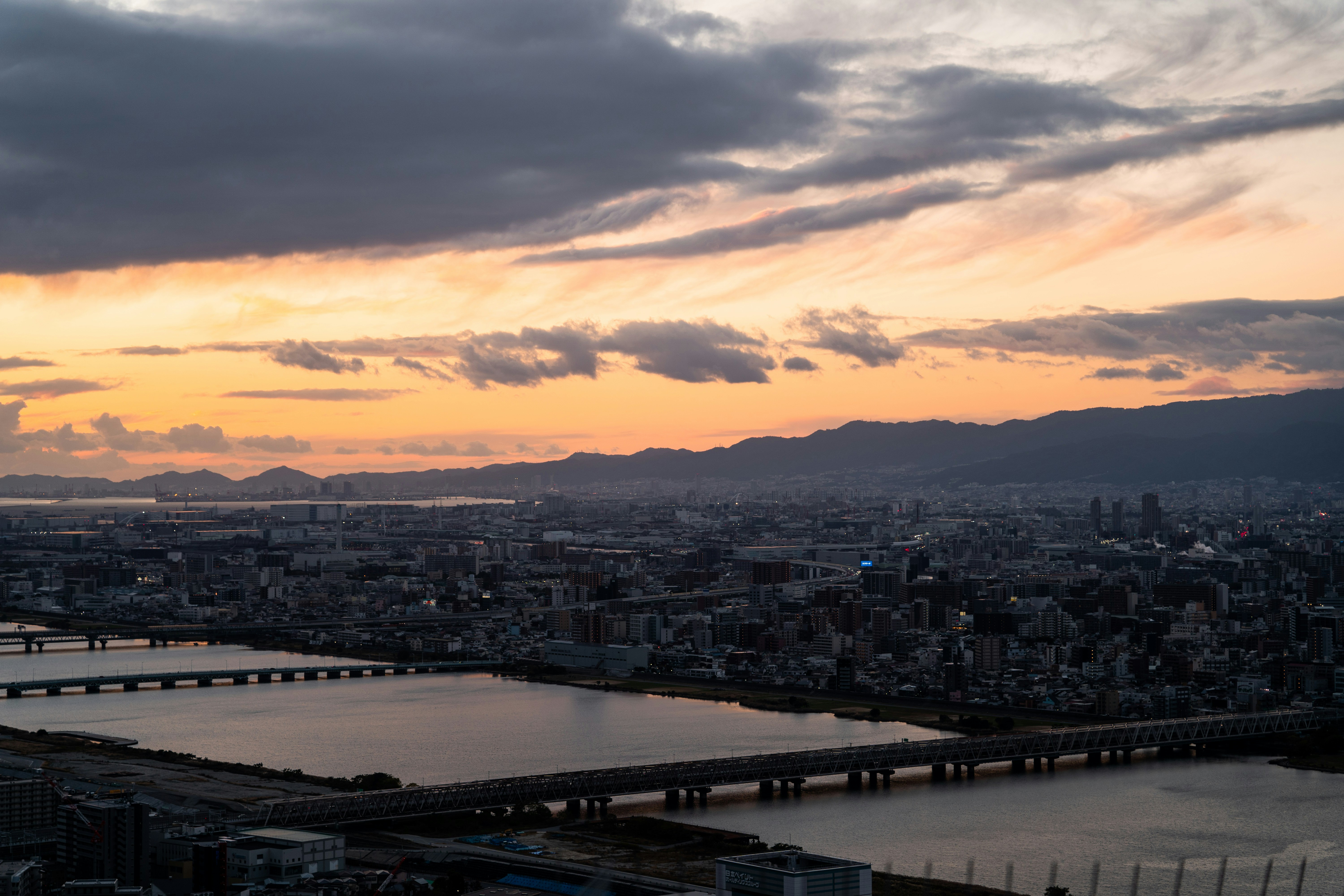 Dusk Over the River City: A Silent Sunset Over the Urban Spine