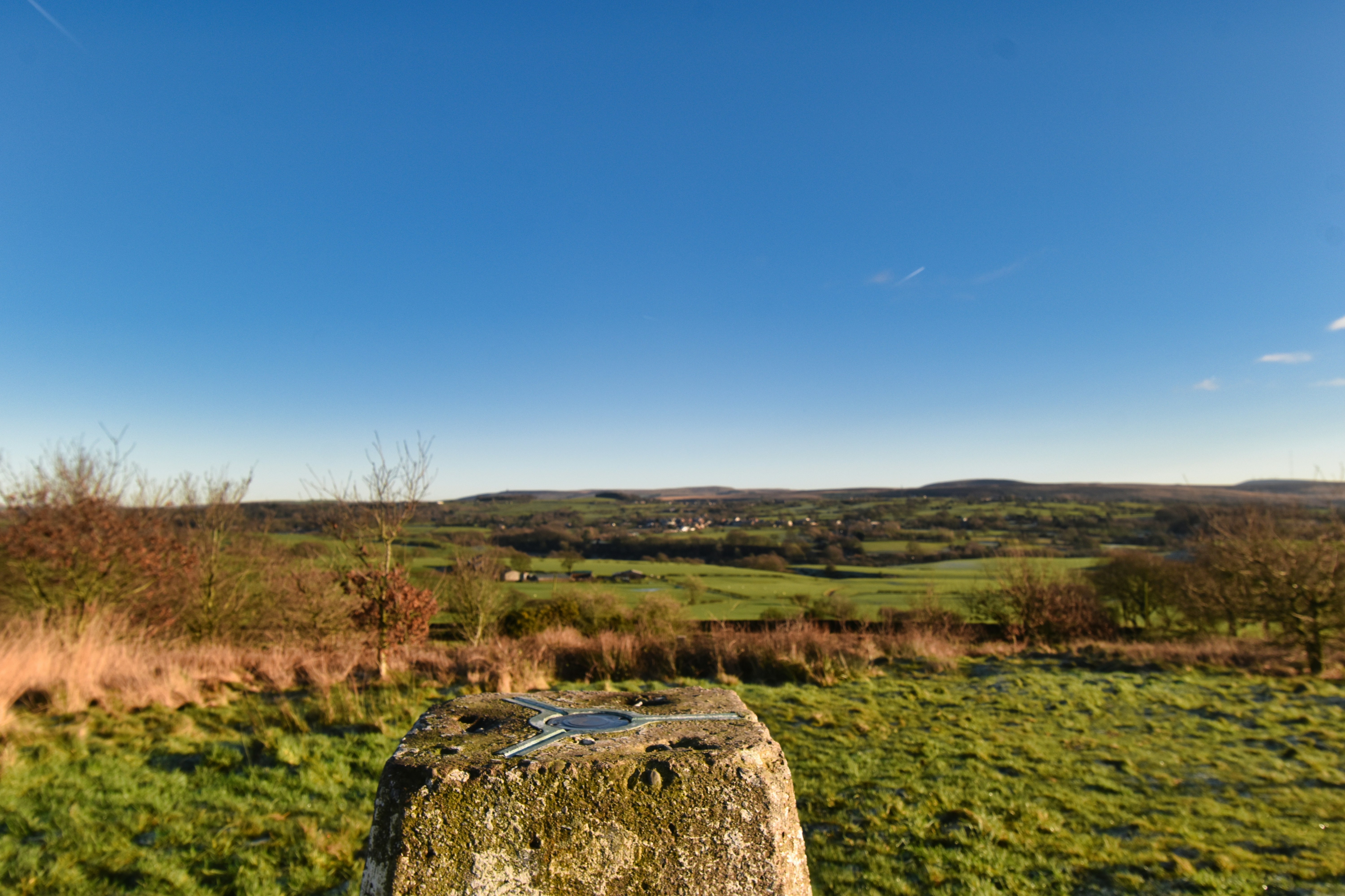 A large rock in a grassy field under a blue sky photo – Free Denham ...