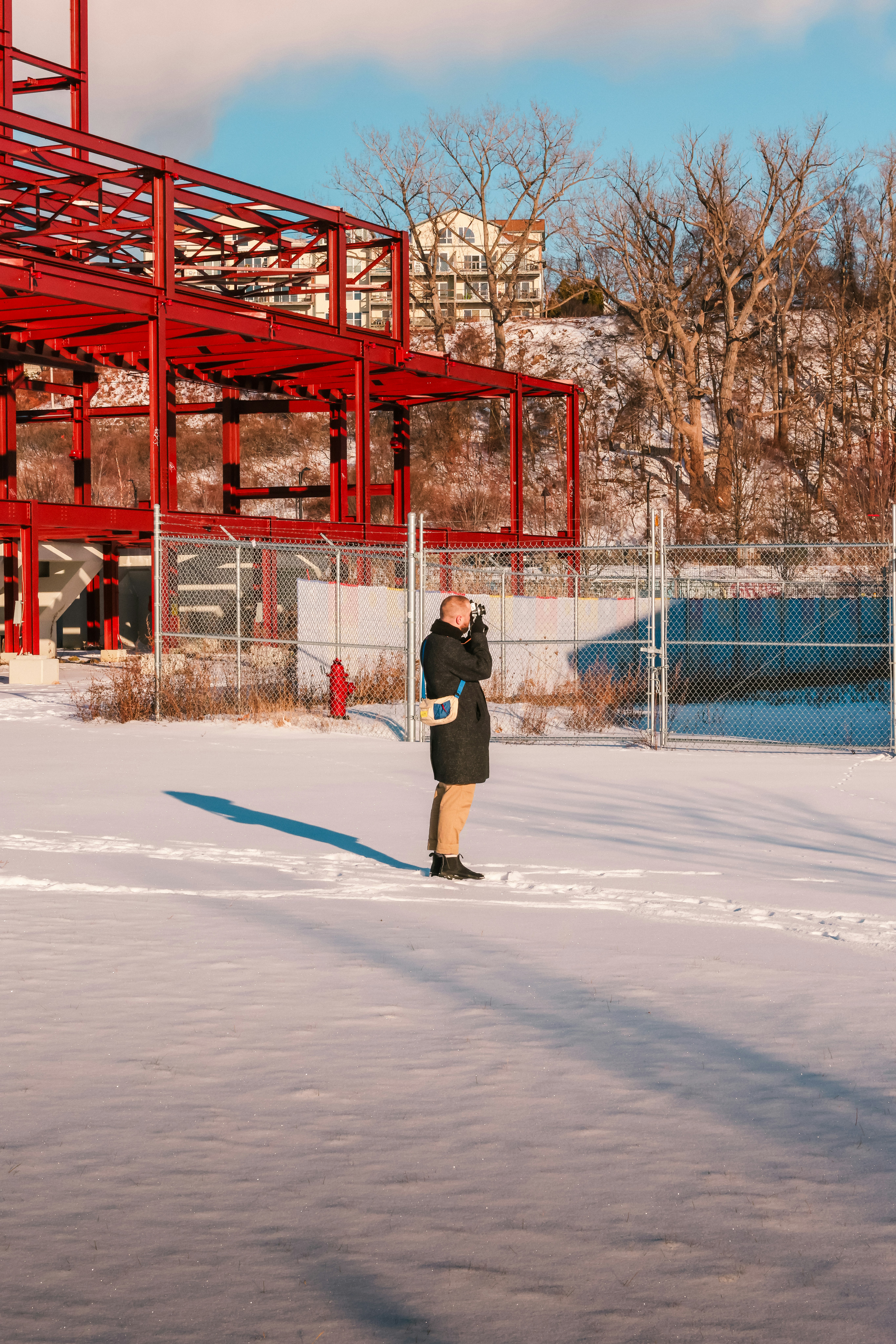 Winter Under the Crimson Frame: A Photographer in Snow