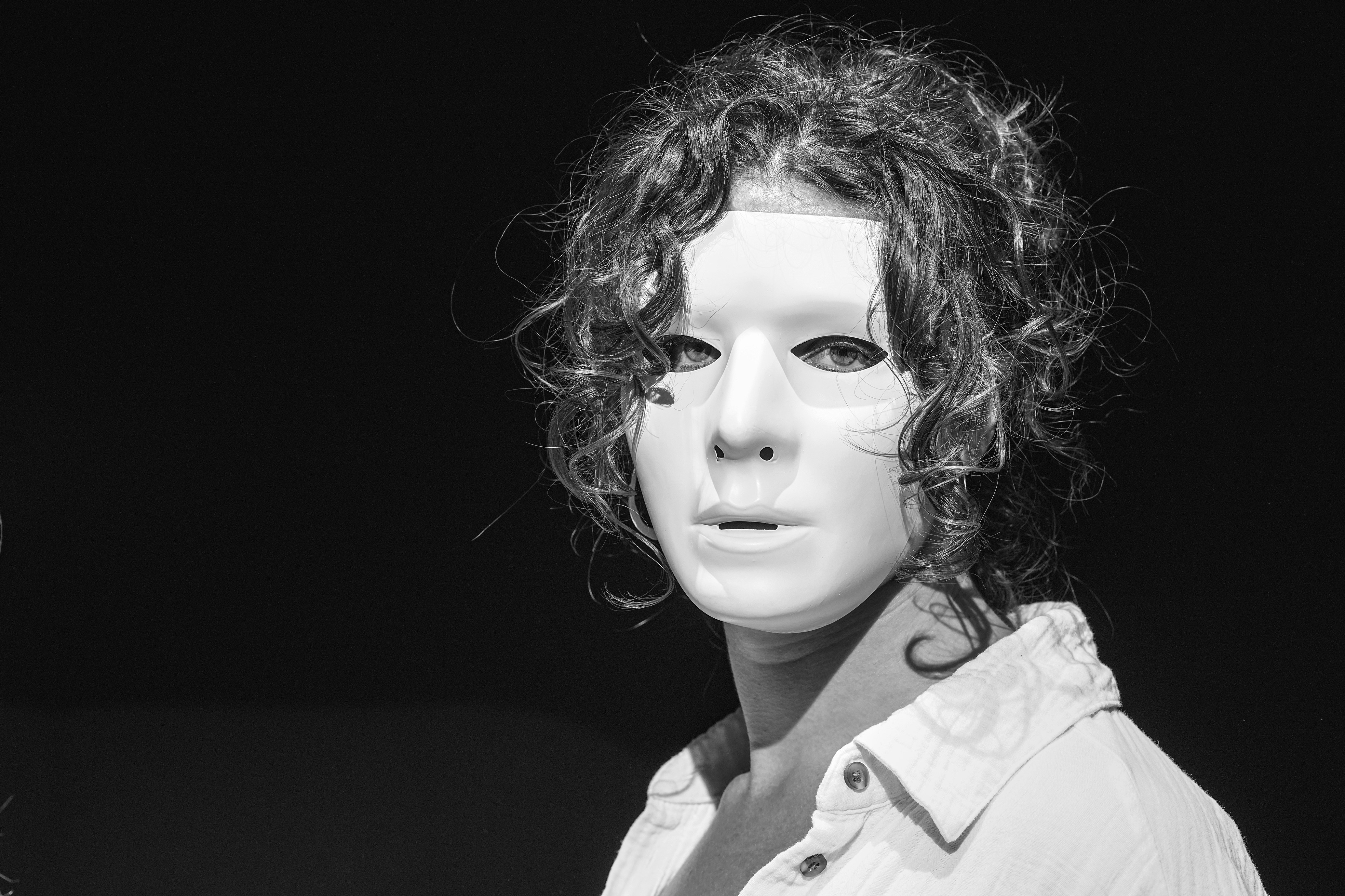 A person with a fake face and a microphone photo – Free Portrait Image ...