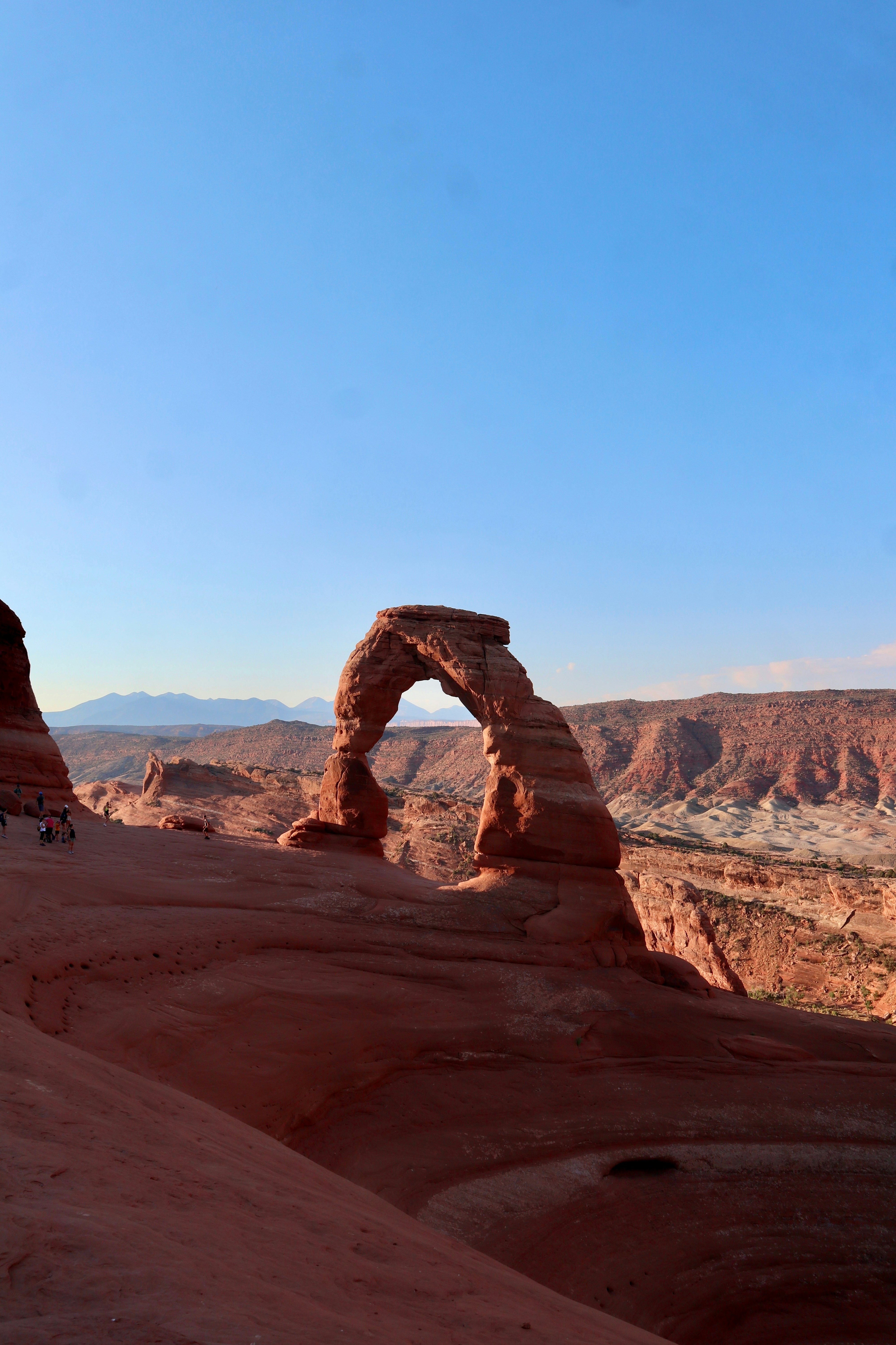 A large rock formation in the middle of a desert photo – Free Arches ...