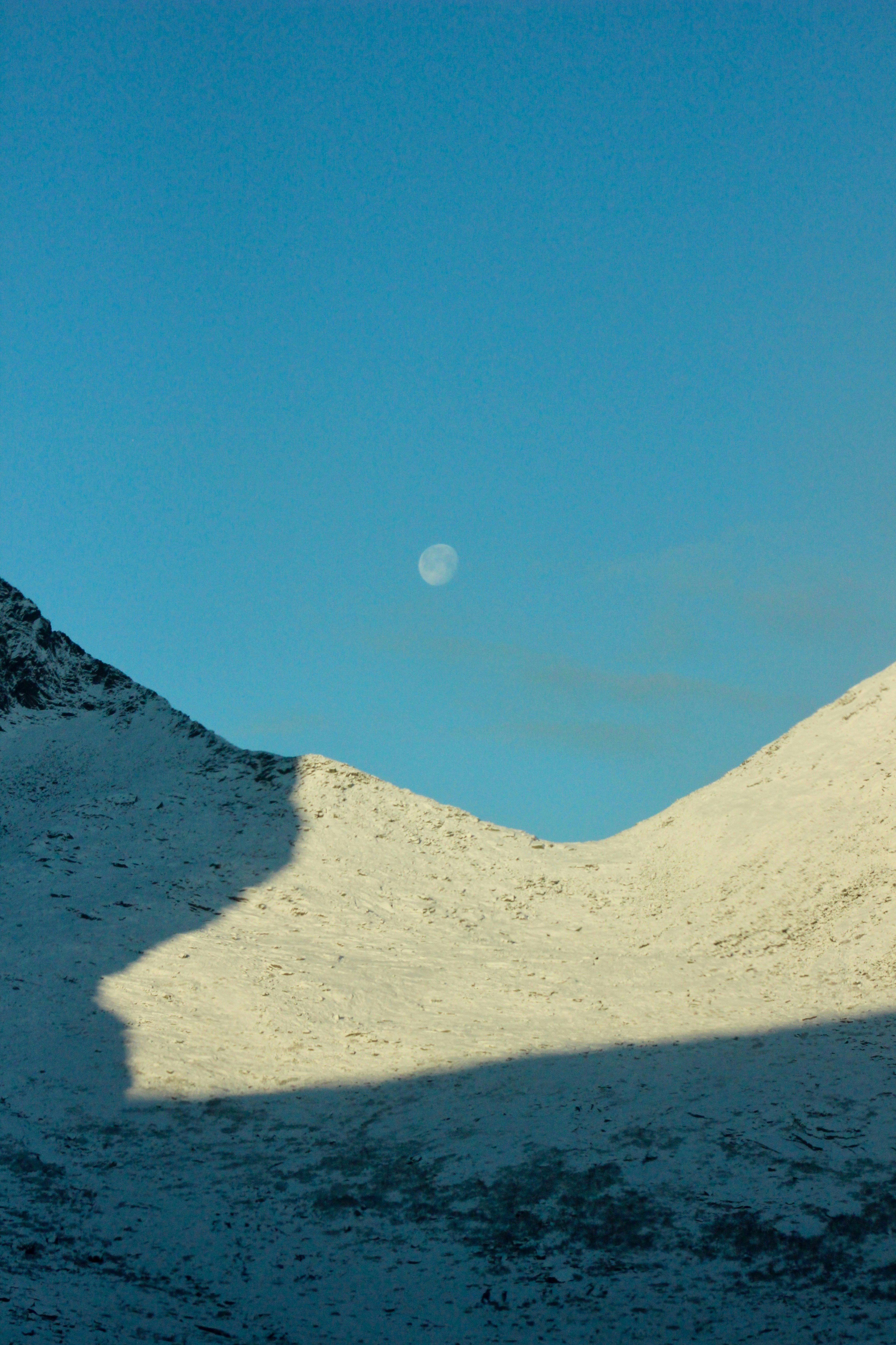 Moon Over a Snowbound Ridge at Blue Hour