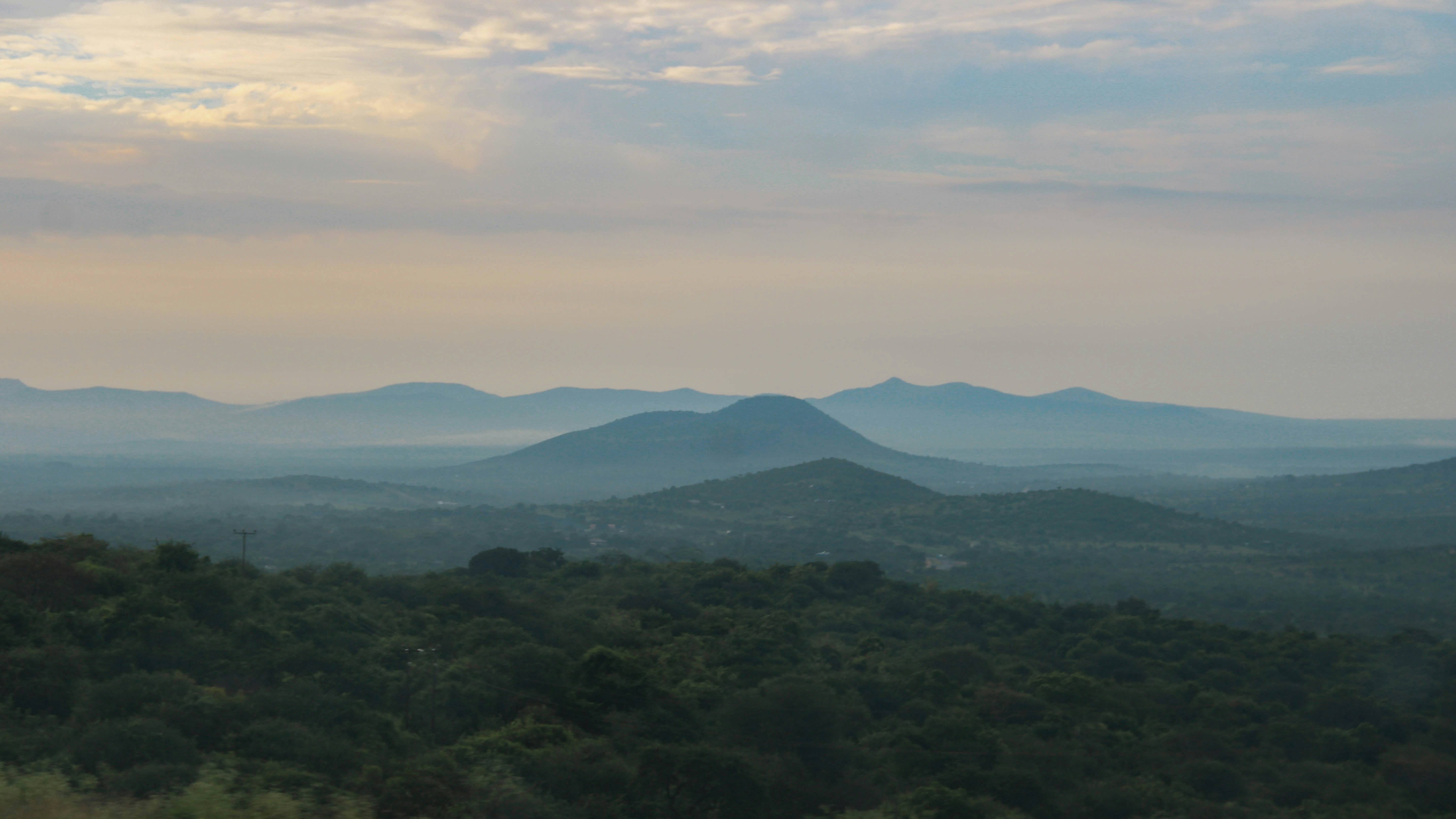 A view of a mountain range from a distance photo – Free Kenya Image on ...