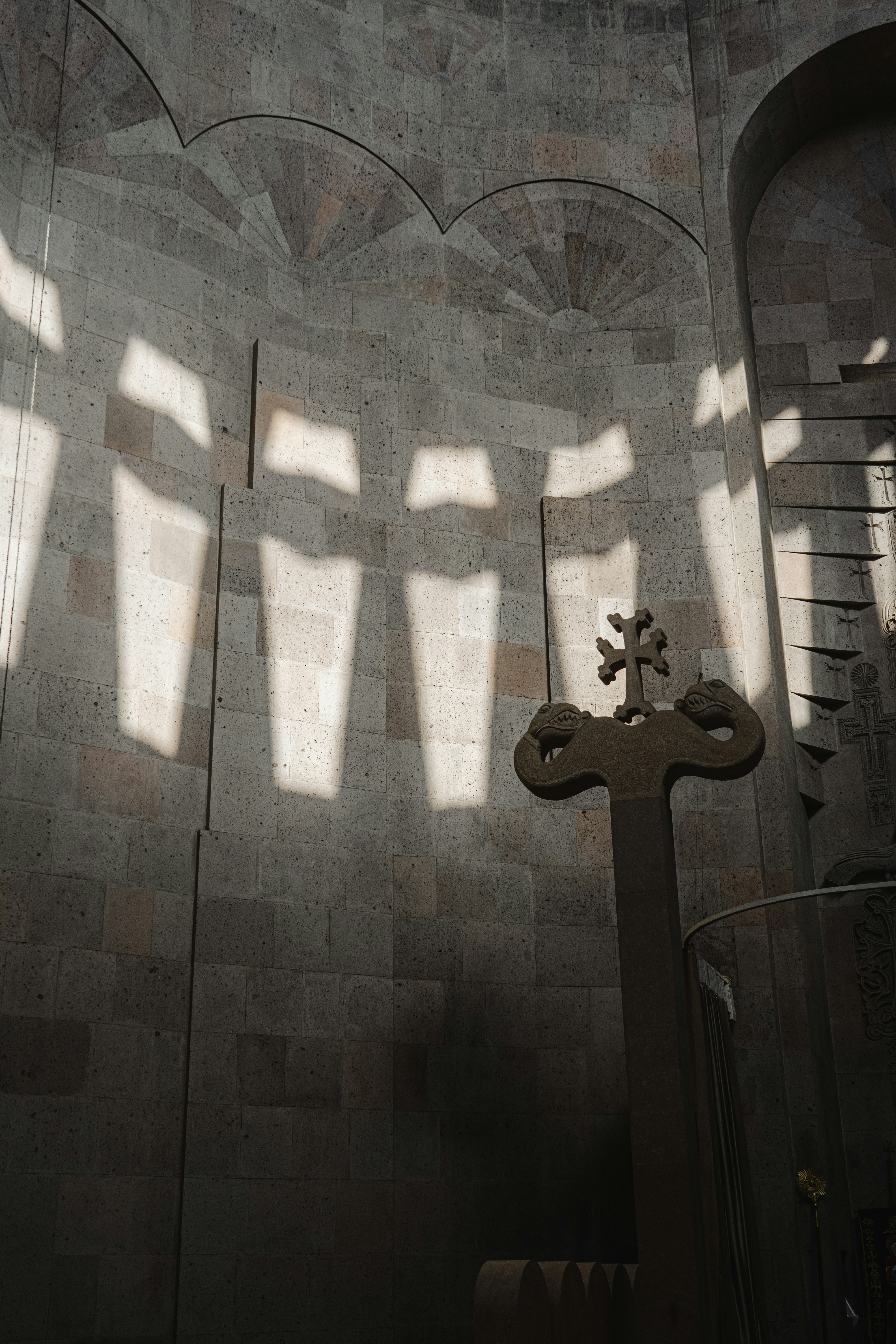 Iron Cross and Geometry of Light on a Cathedral Wall