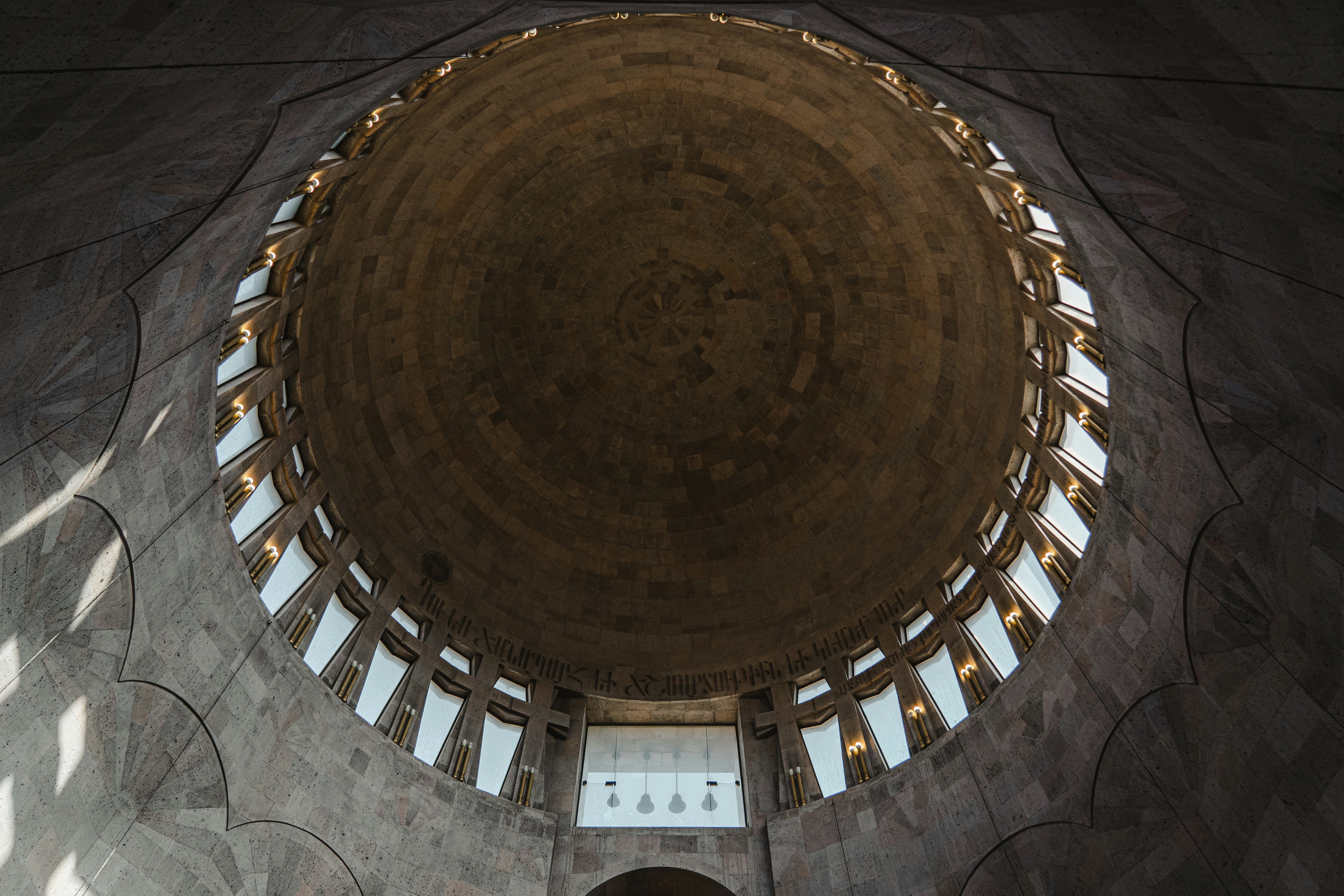 Oculus of Light: Circular Rotunda Embraces Daylight through Arched Colonnades