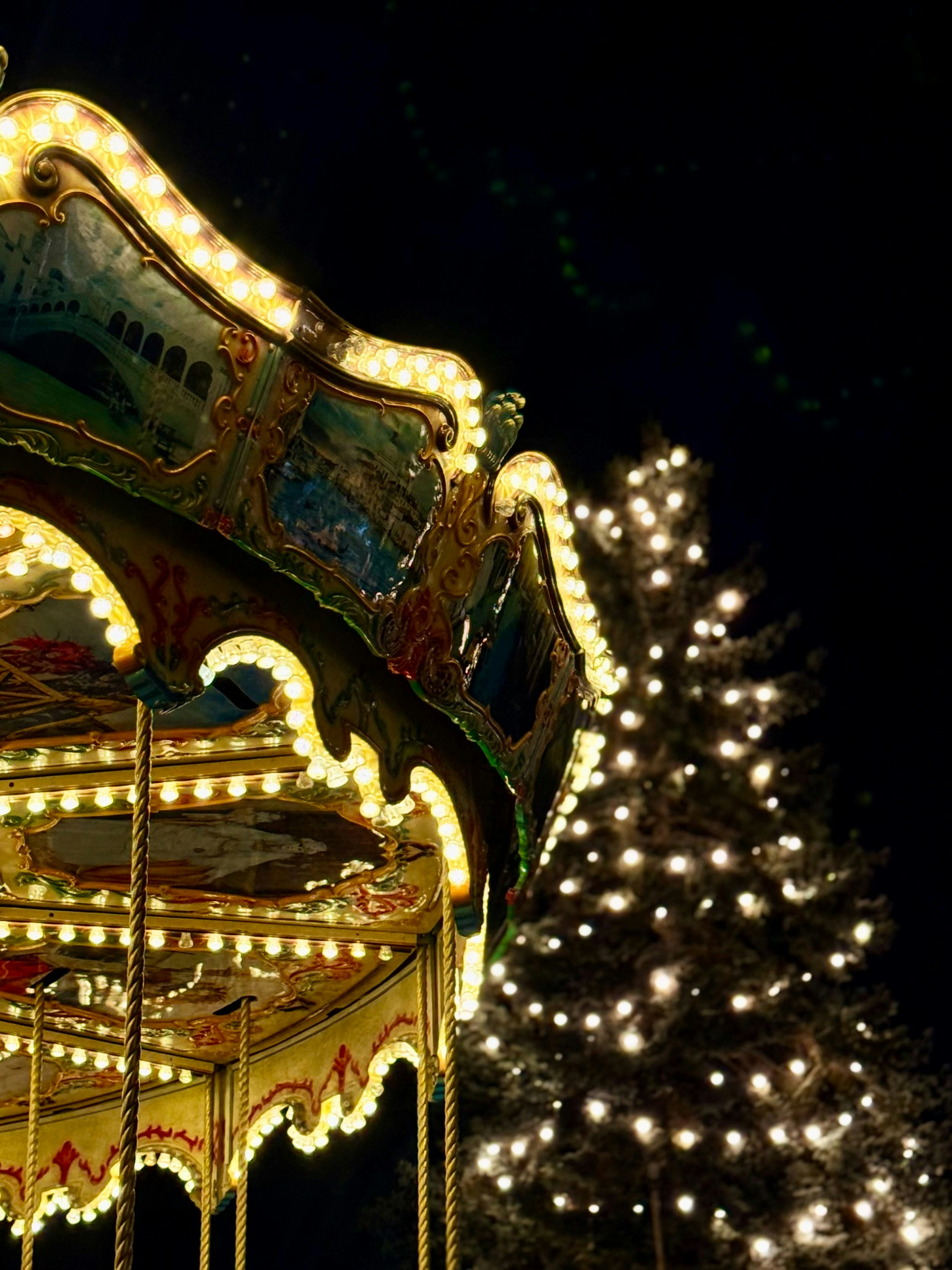 Night Carousel Glow: Ornate Canopy and Festooned Lights