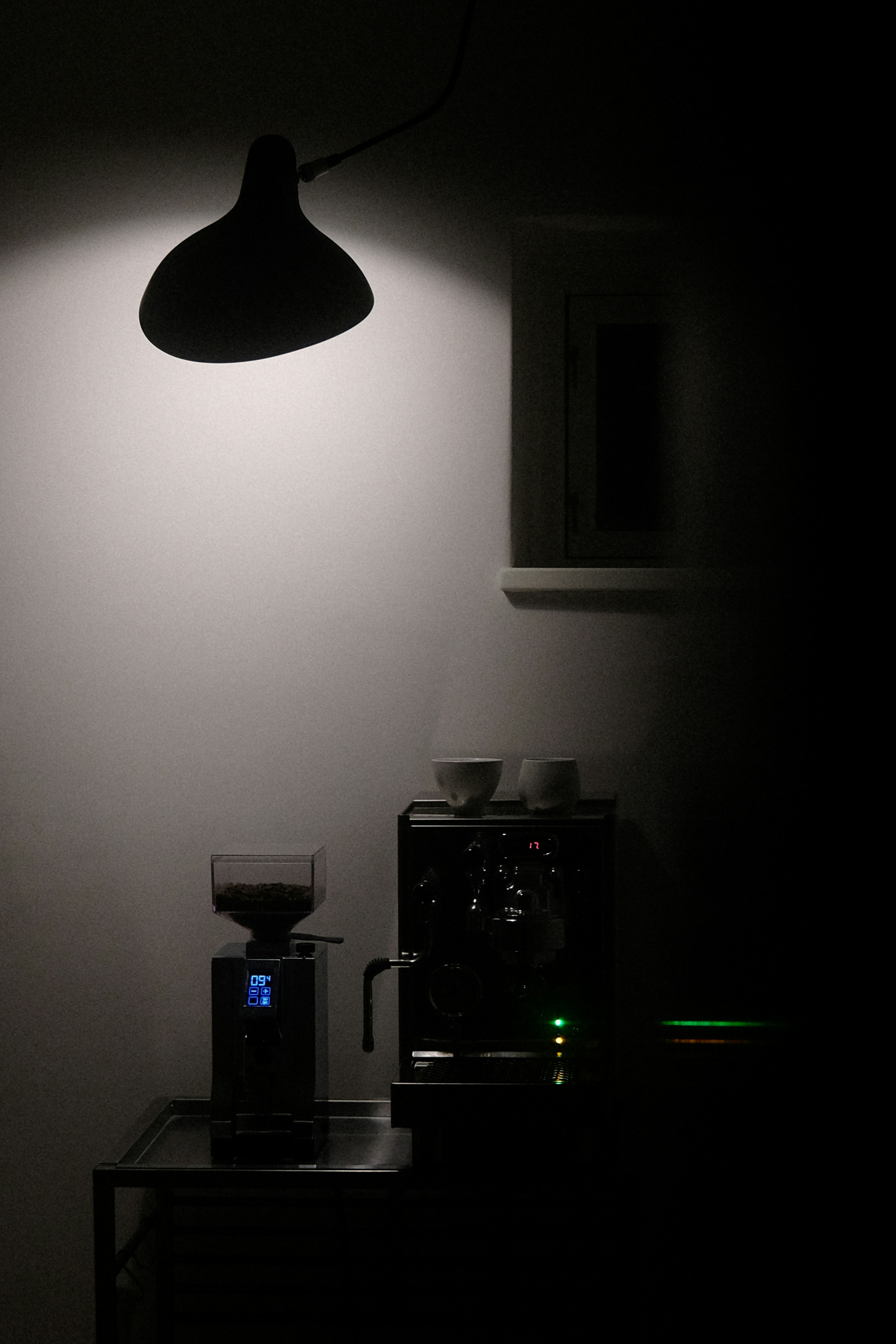 A dark room with a lamp and a coffee maker photo – Free Coffee setup ...