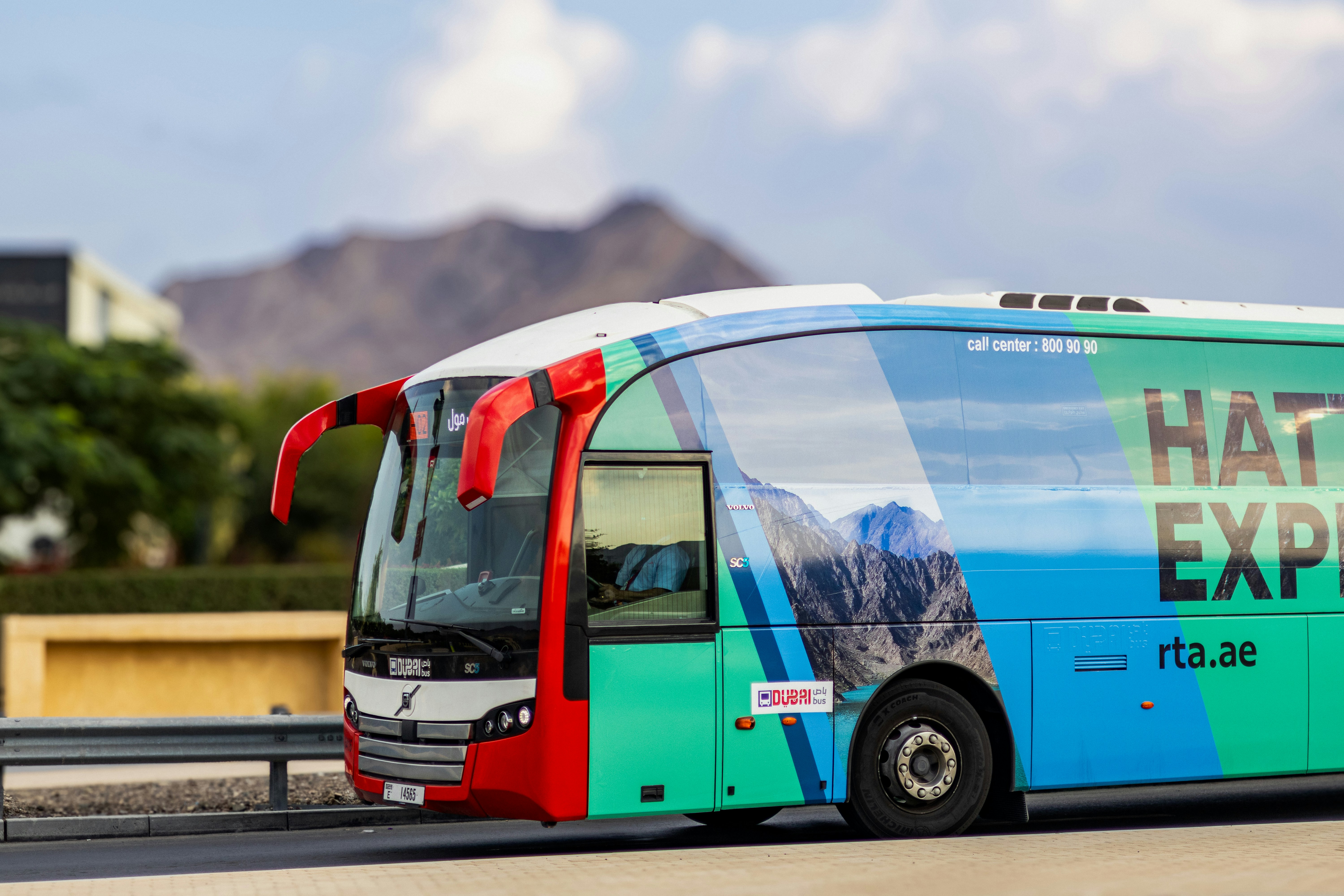 A bus parked on the side of the road photo – Free Hatta - dubai ...