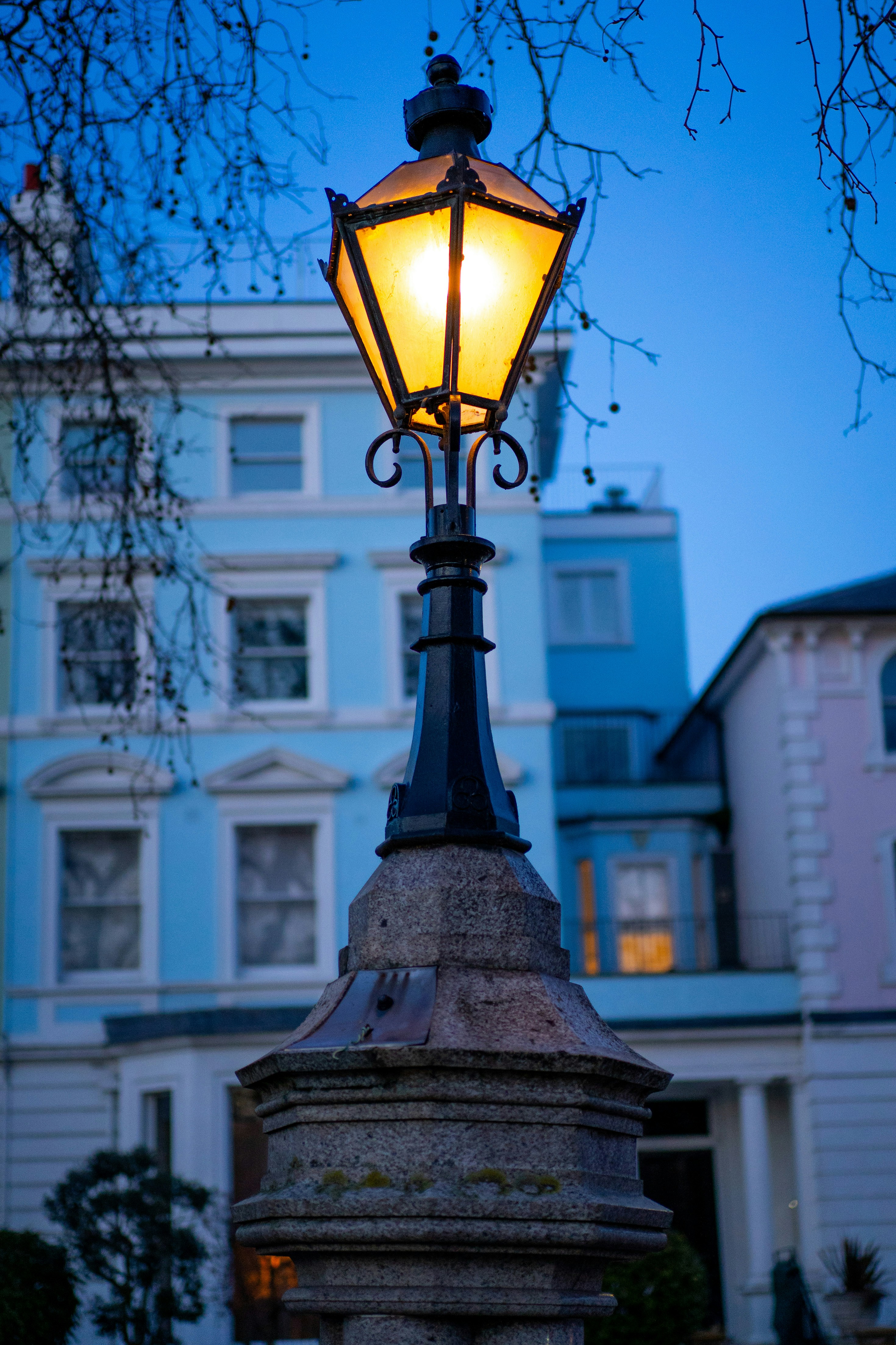 A lamp post with a building in the background photo – Free London Image ...