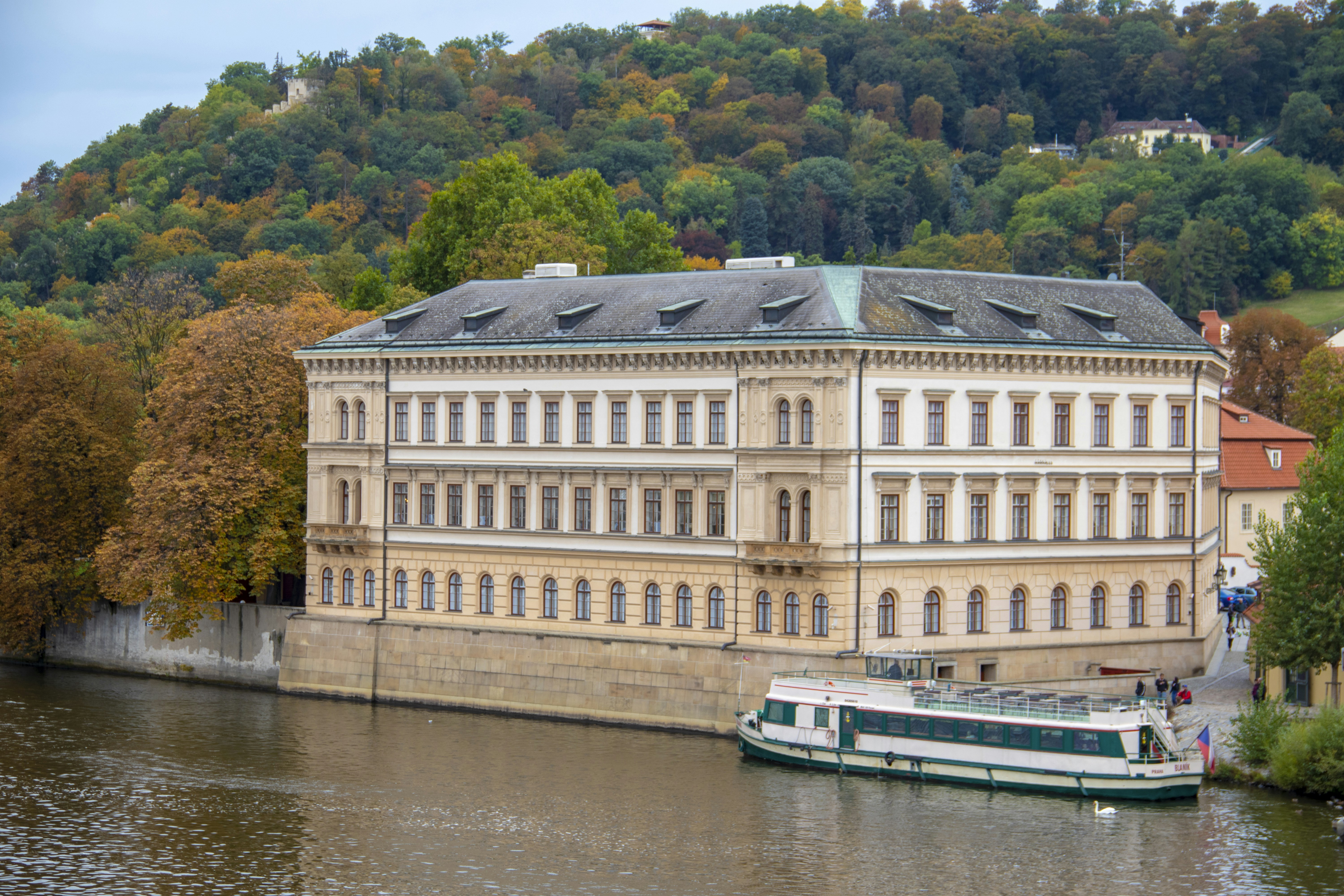 Riverside Chateau: A Baroque-Styled Building Docked Along the Calm Tranquil Waters