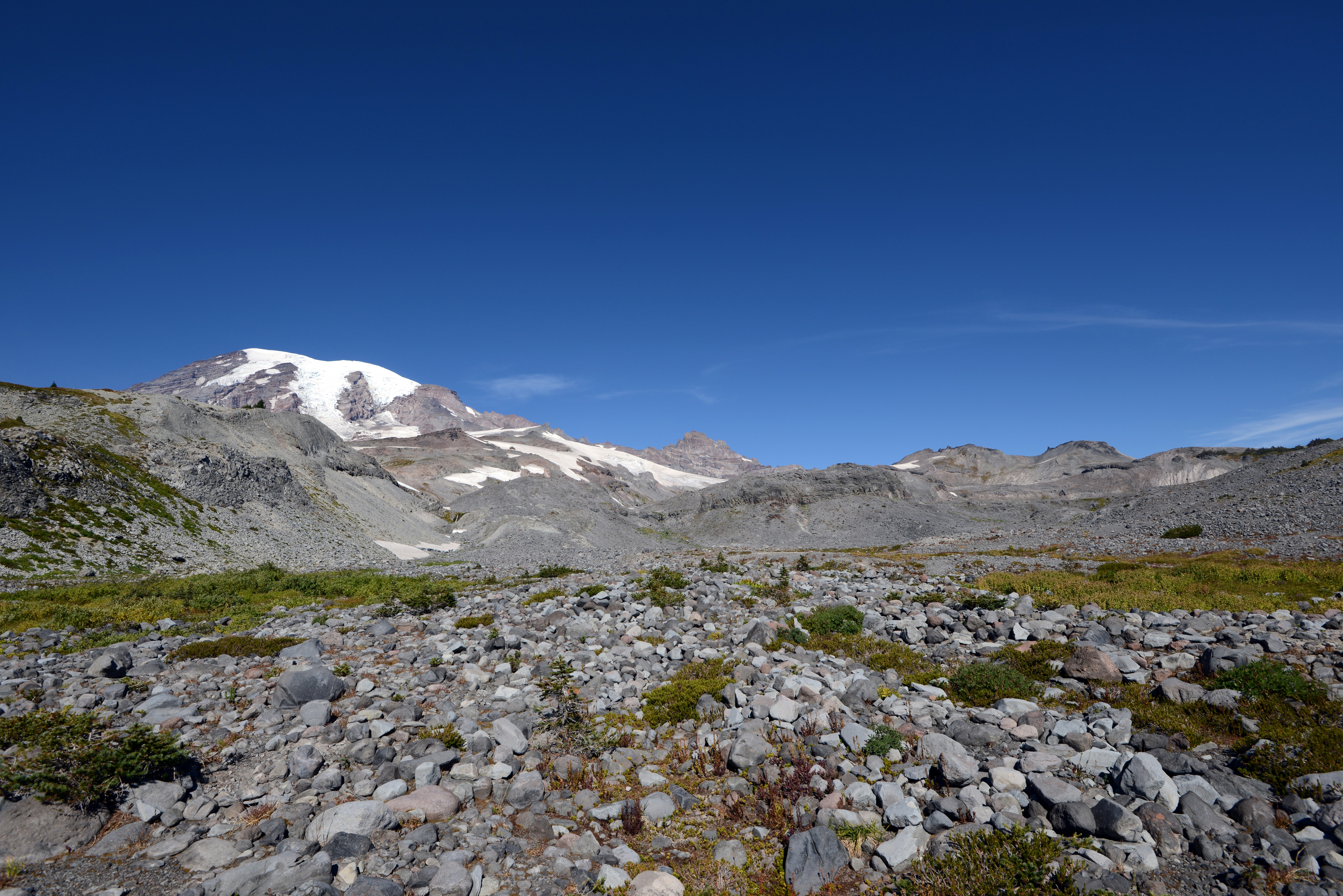 A rocky field with a mountain in the background photo – Free Washington ...