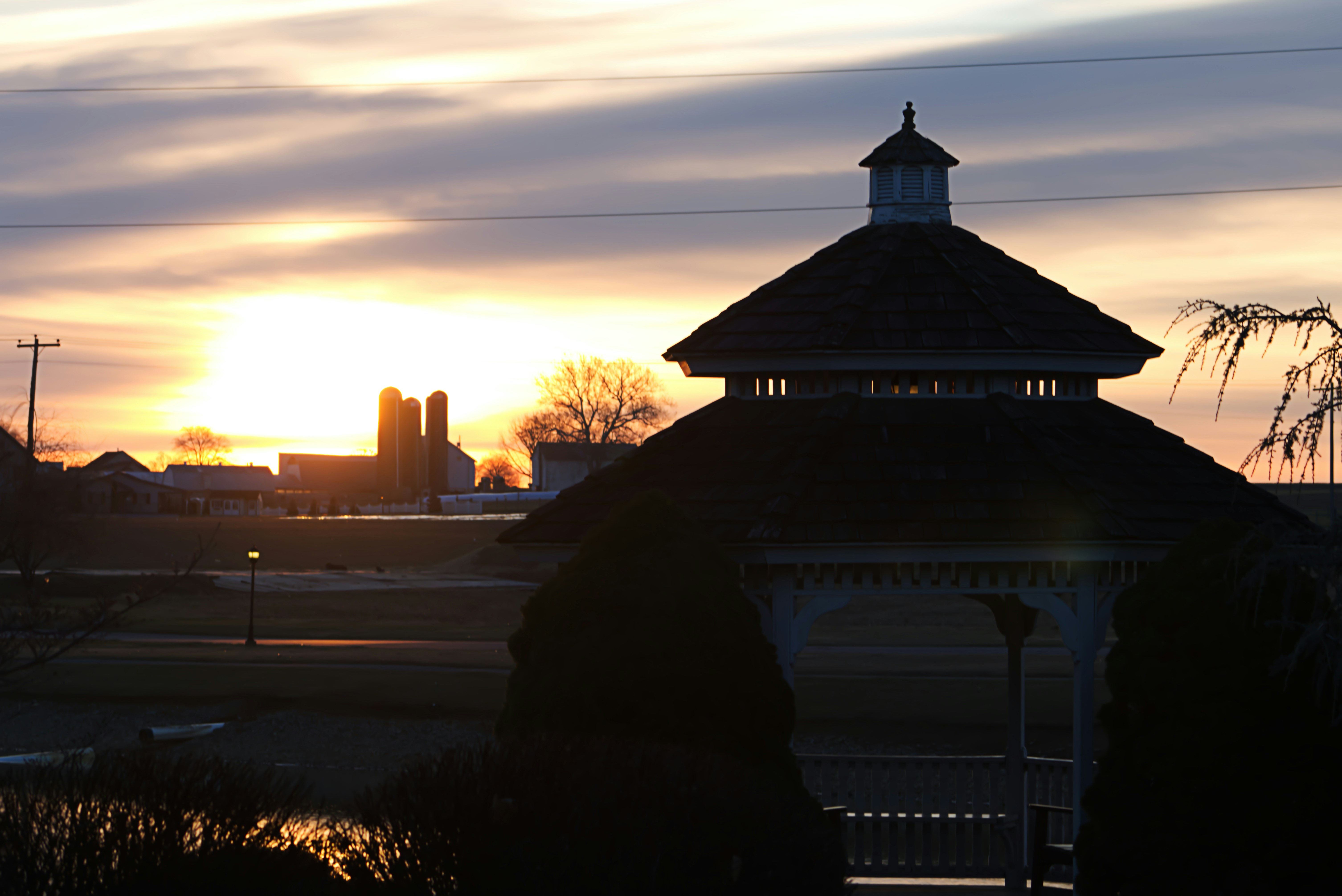 Silhouette at Dusk: The Pavilion and Sunset Horizon