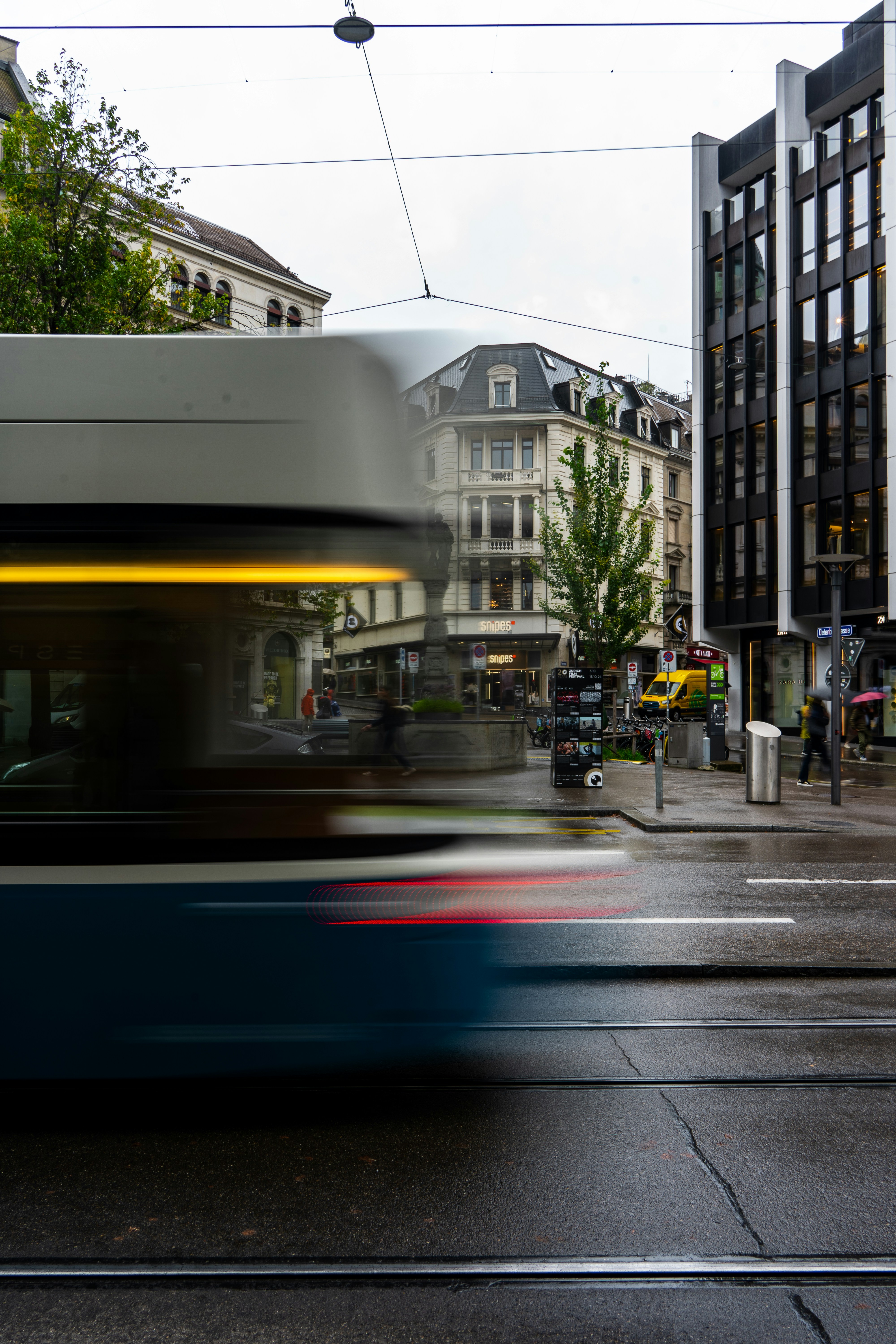 A blurry photo of a bus on a city street photo – Free Switzerland Image ...