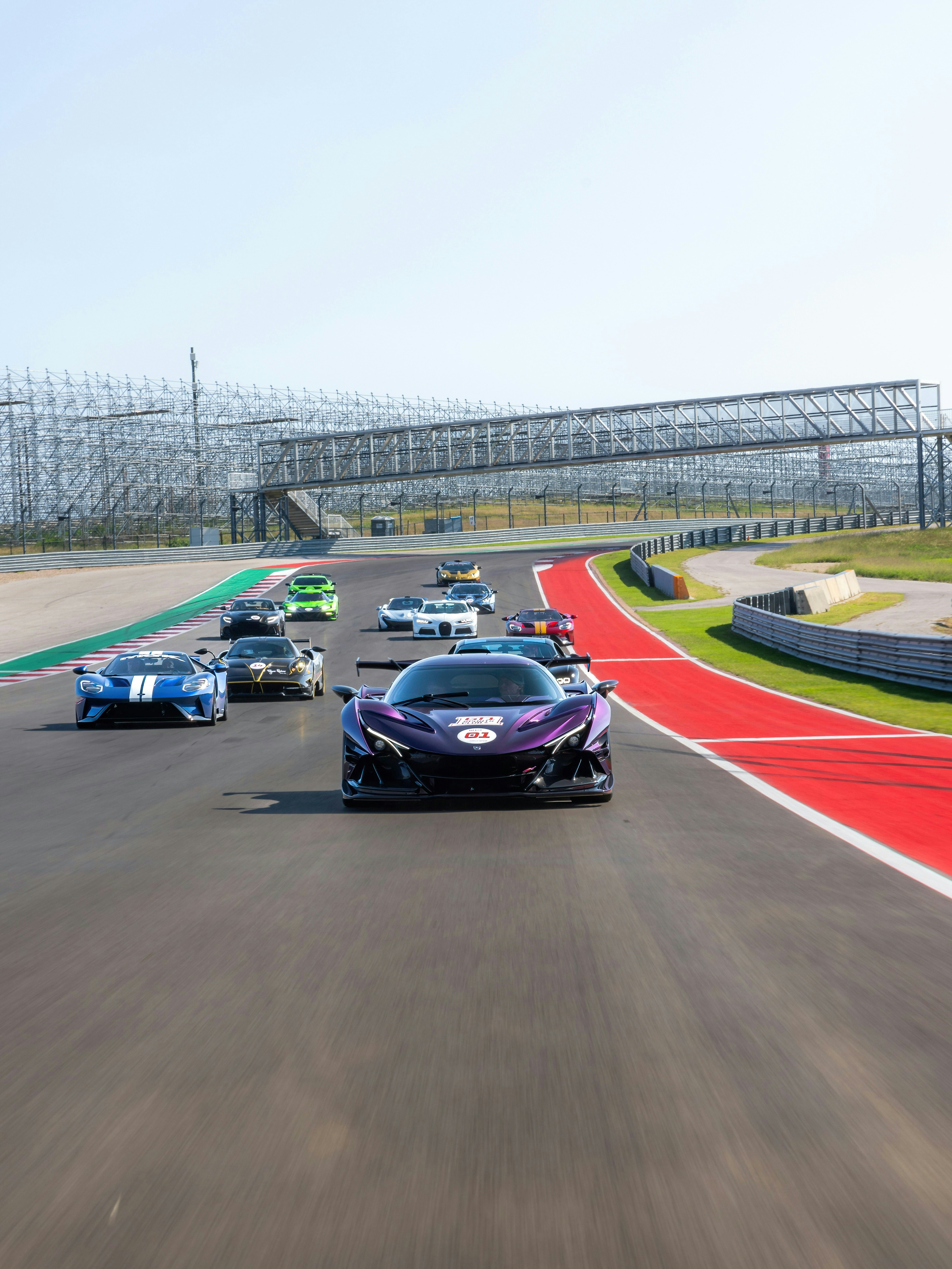 A group of cars driving down a race track photo – Free Automobile Image ...