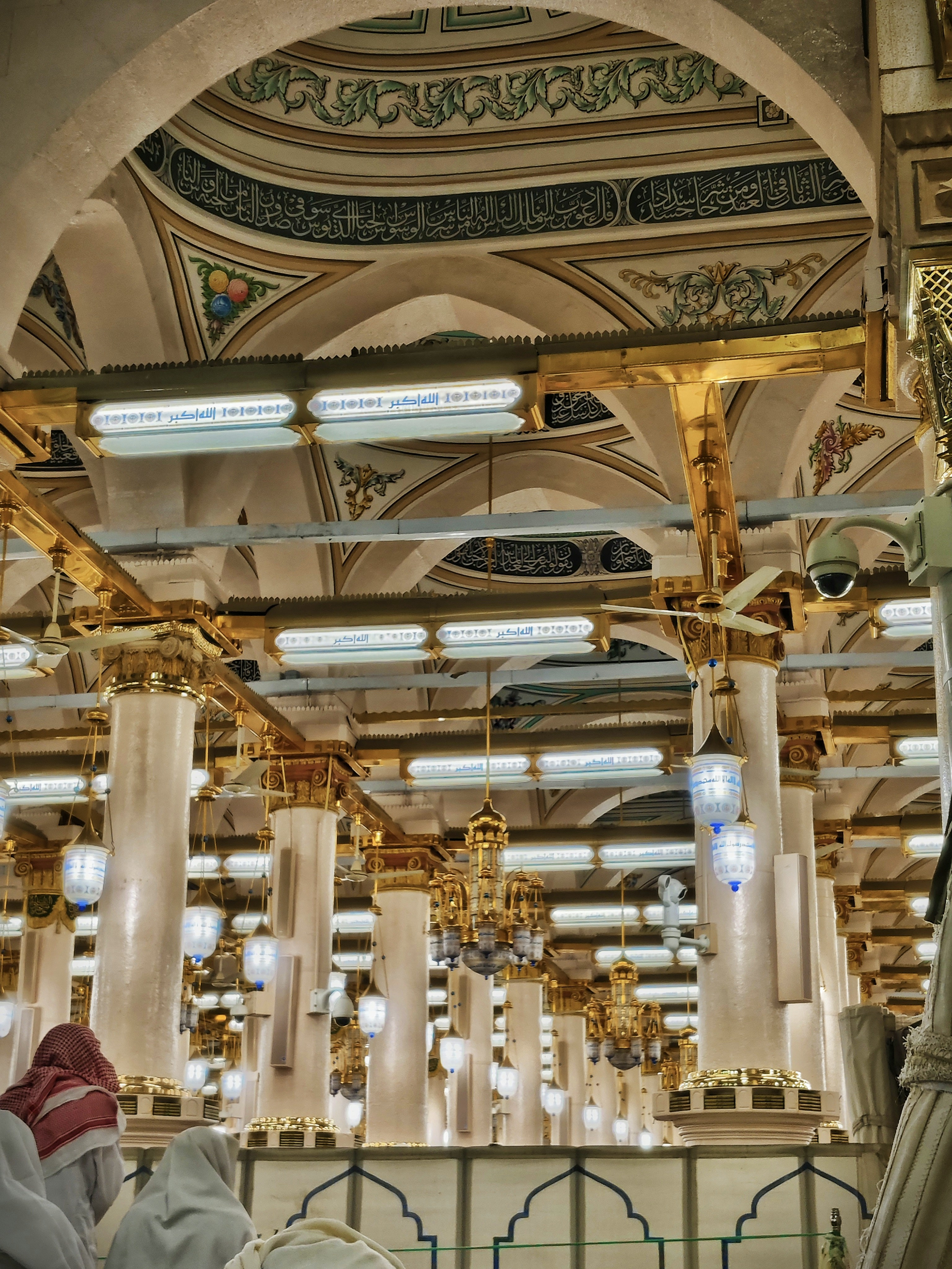 Luminous Arches and Golden Chandeliers Over Marble Columns