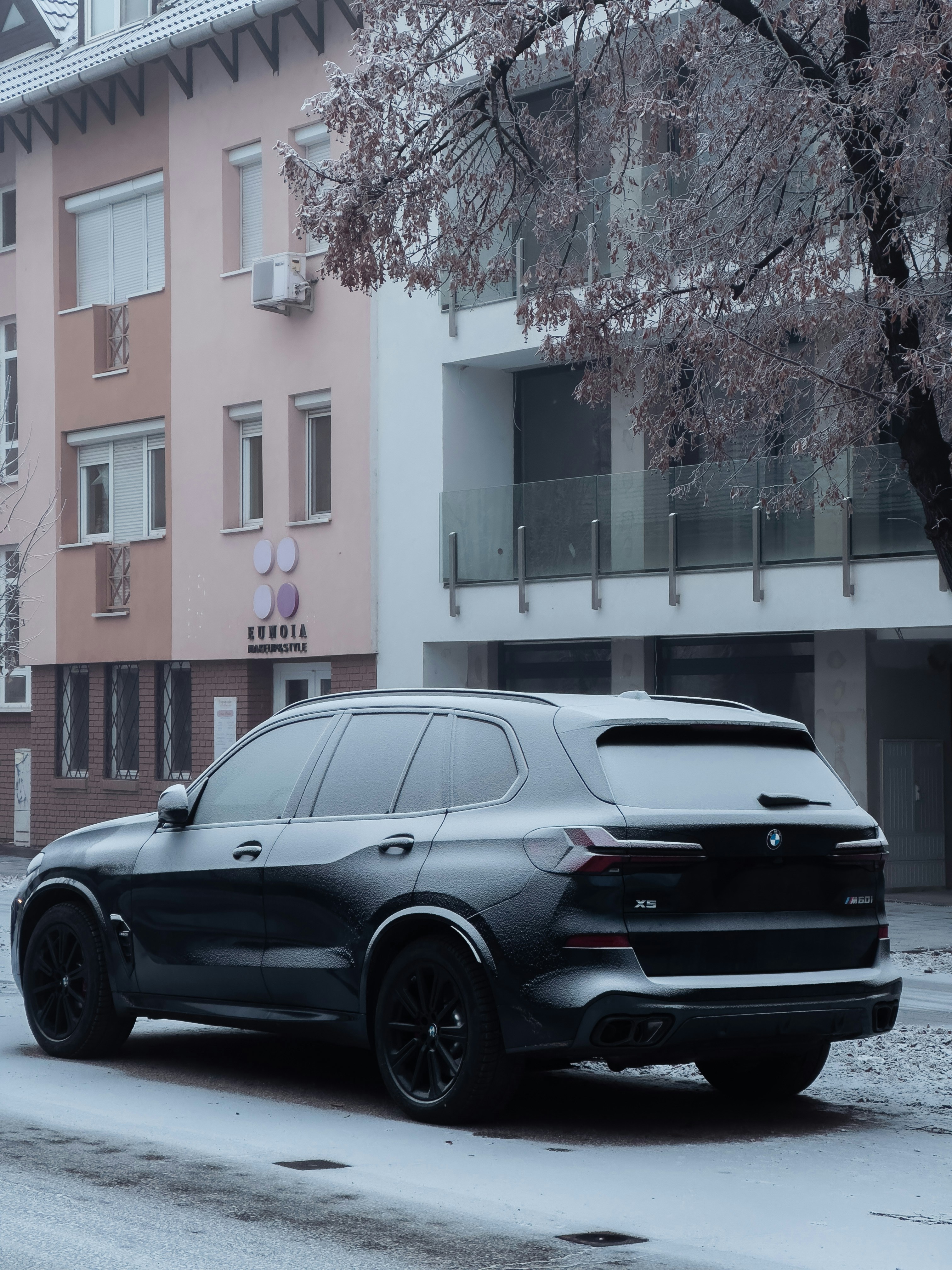 Mercedes-Benz GLS-inspired stance: a black SUV parked in a frosted urban street