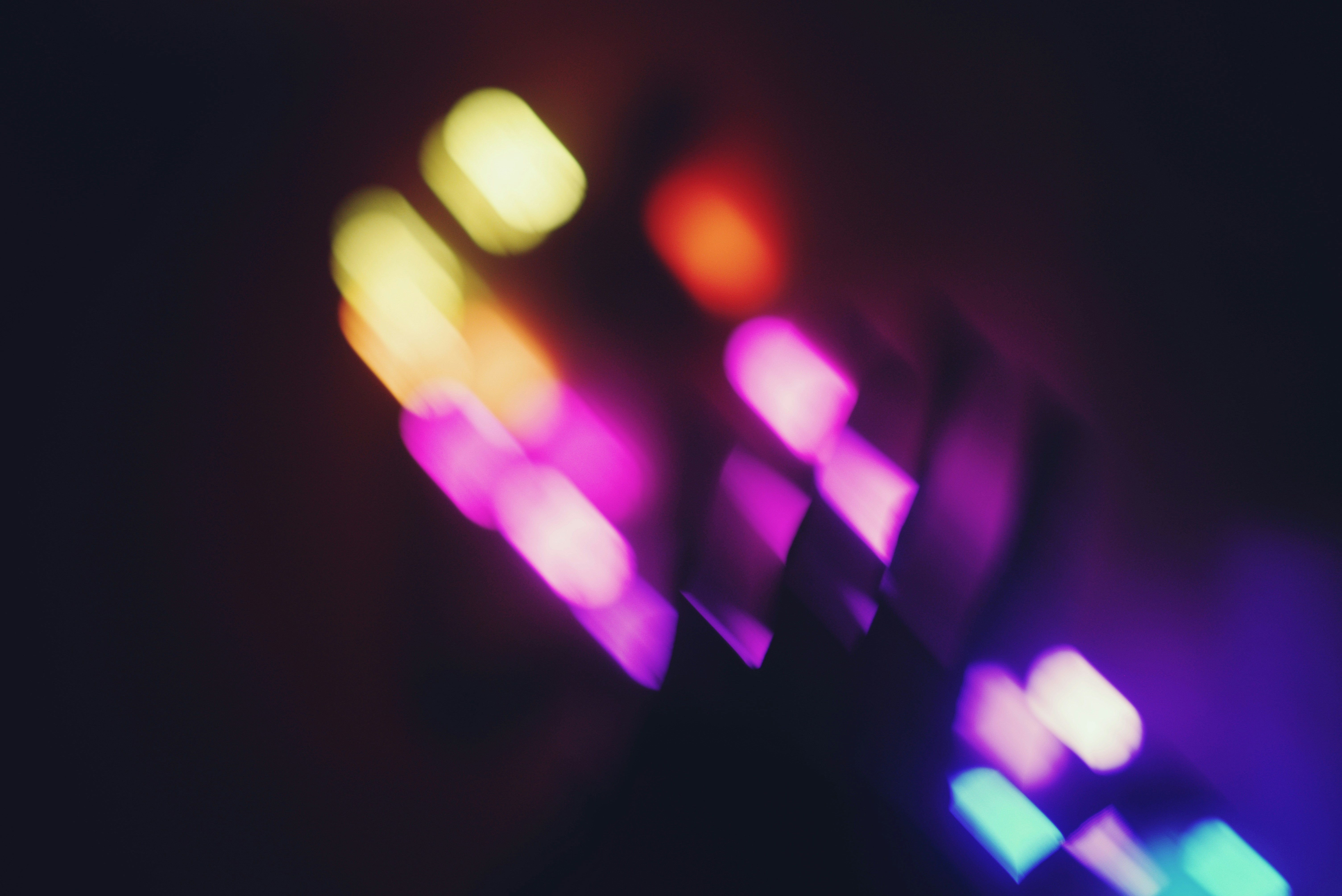 Abstract representation of colorful lights blending into a dreamlike blur, creating a sense of movement and energy.