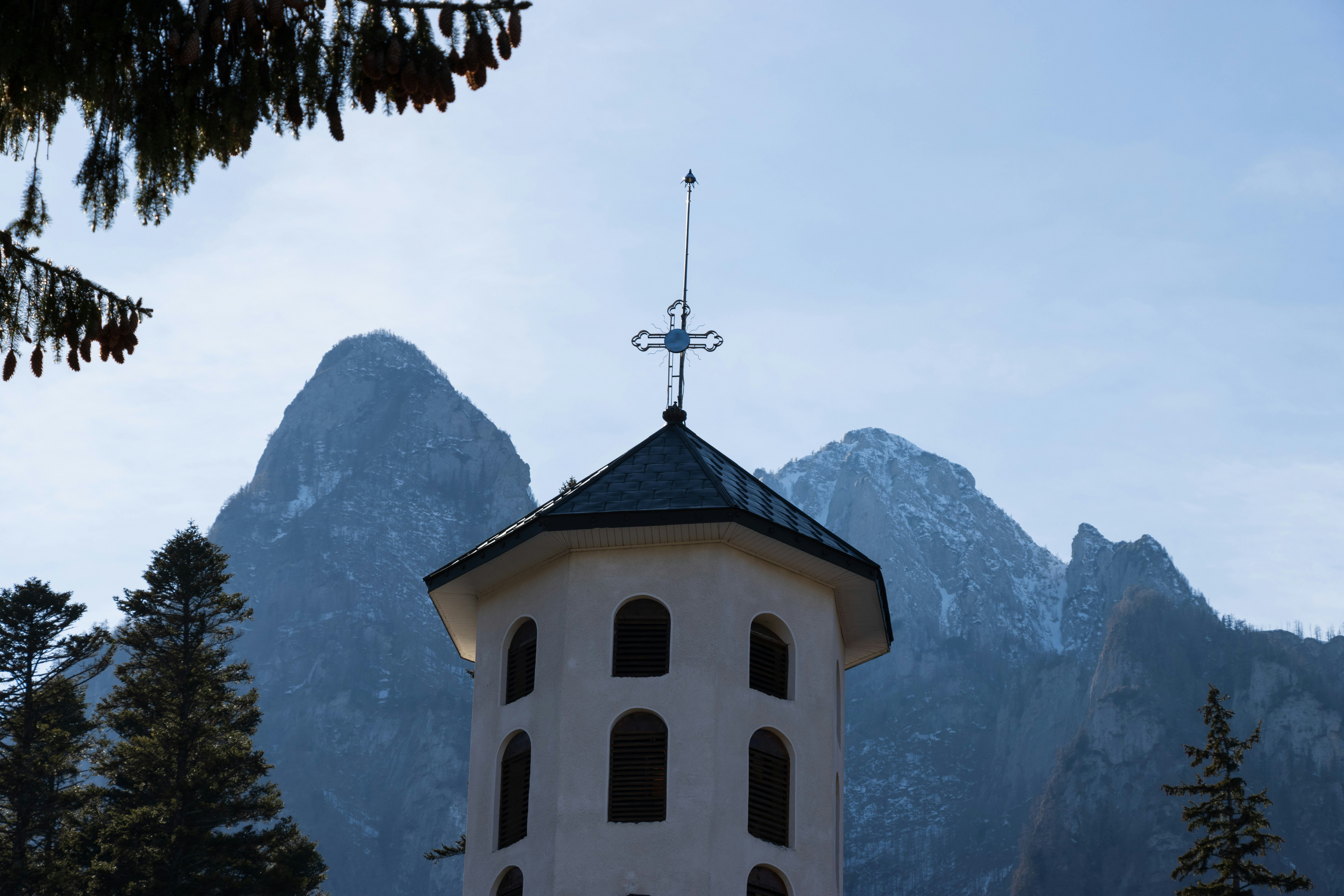 A tower with a weather vane on top of it photo – Free Predeal Image on ...
