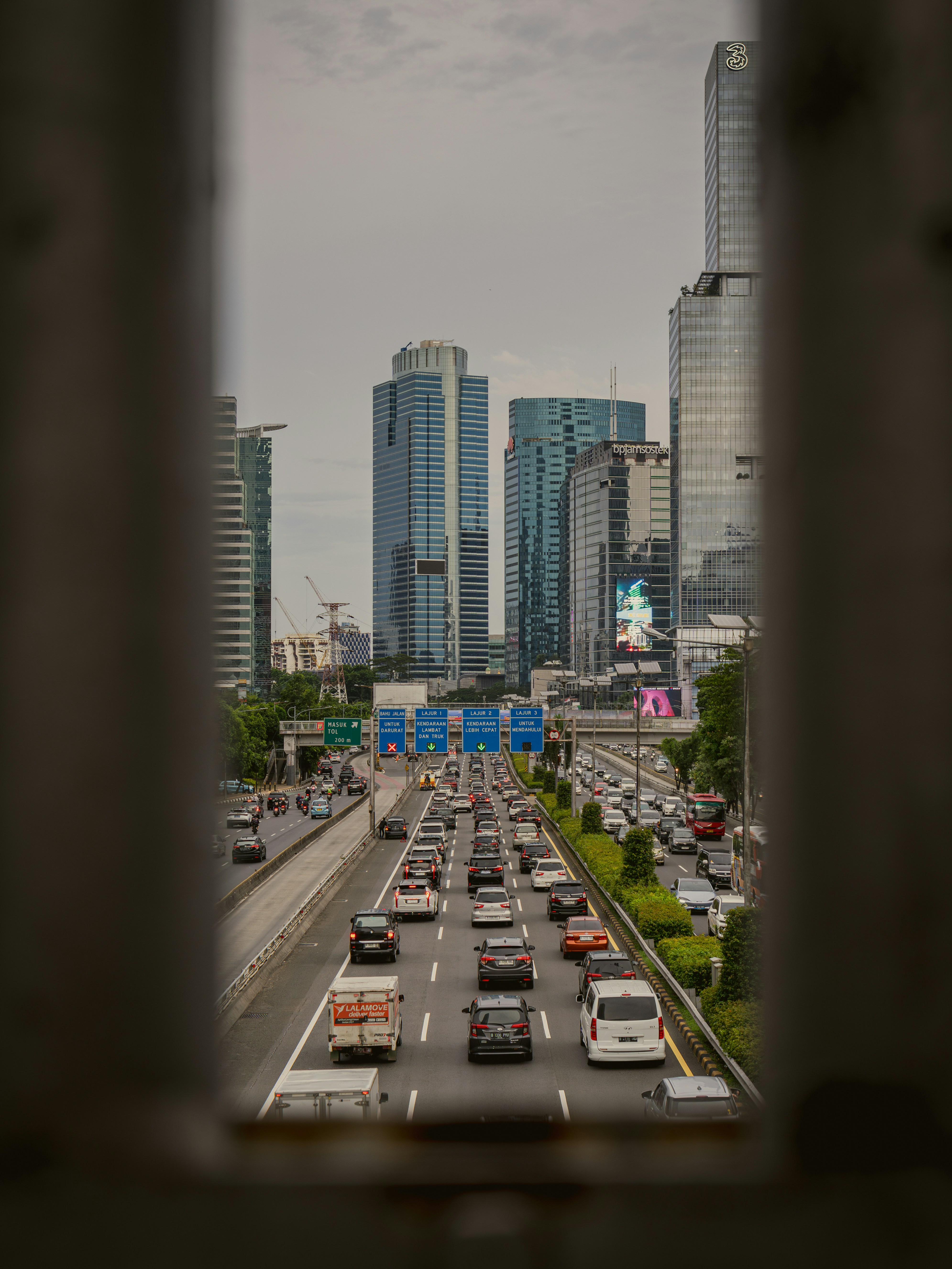 A view of a city from a window in a building photo – Free Jakarta Image ...