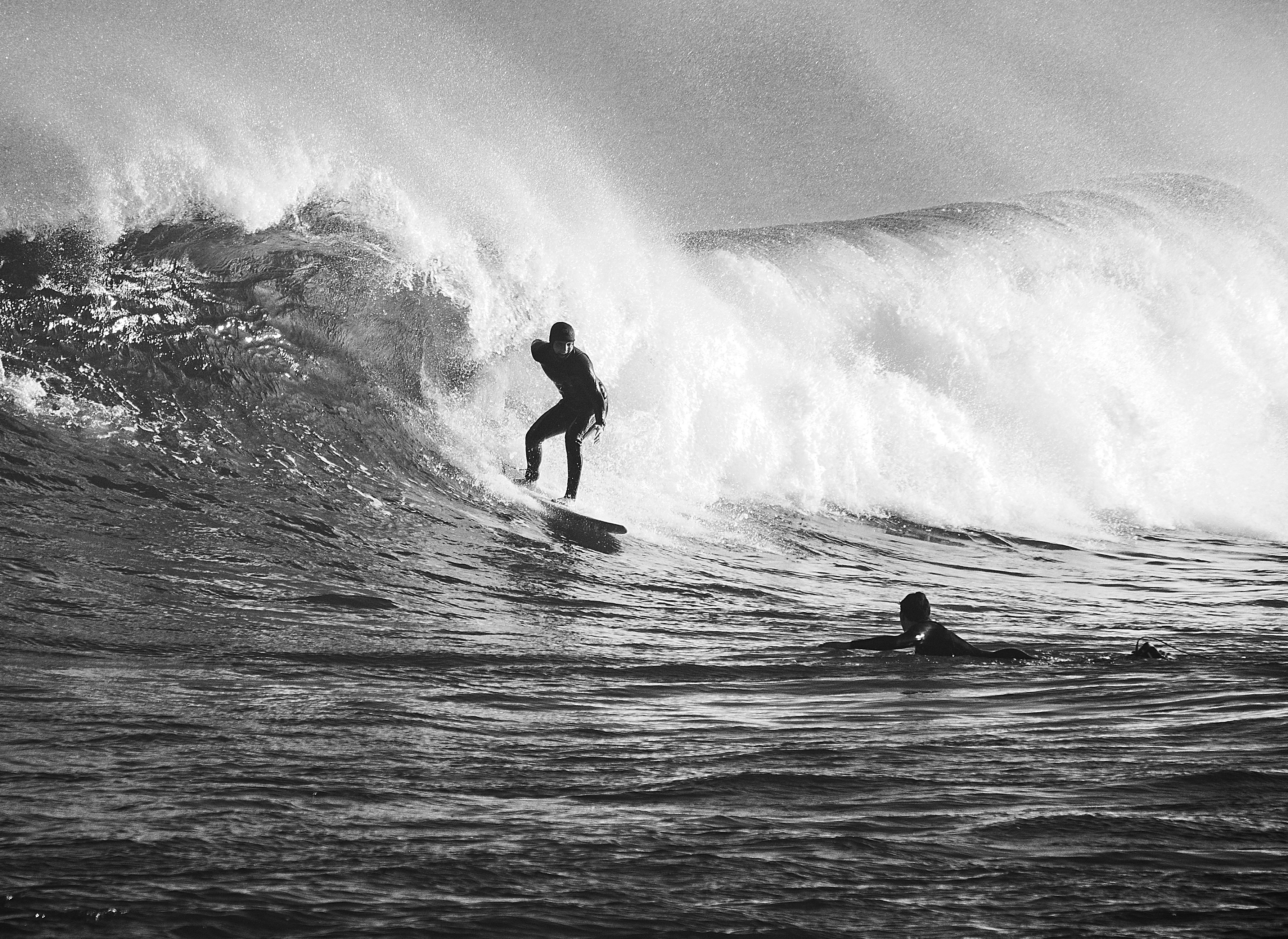 A man riding a wave on top of a surfboard photo – Free Nature Image on ...