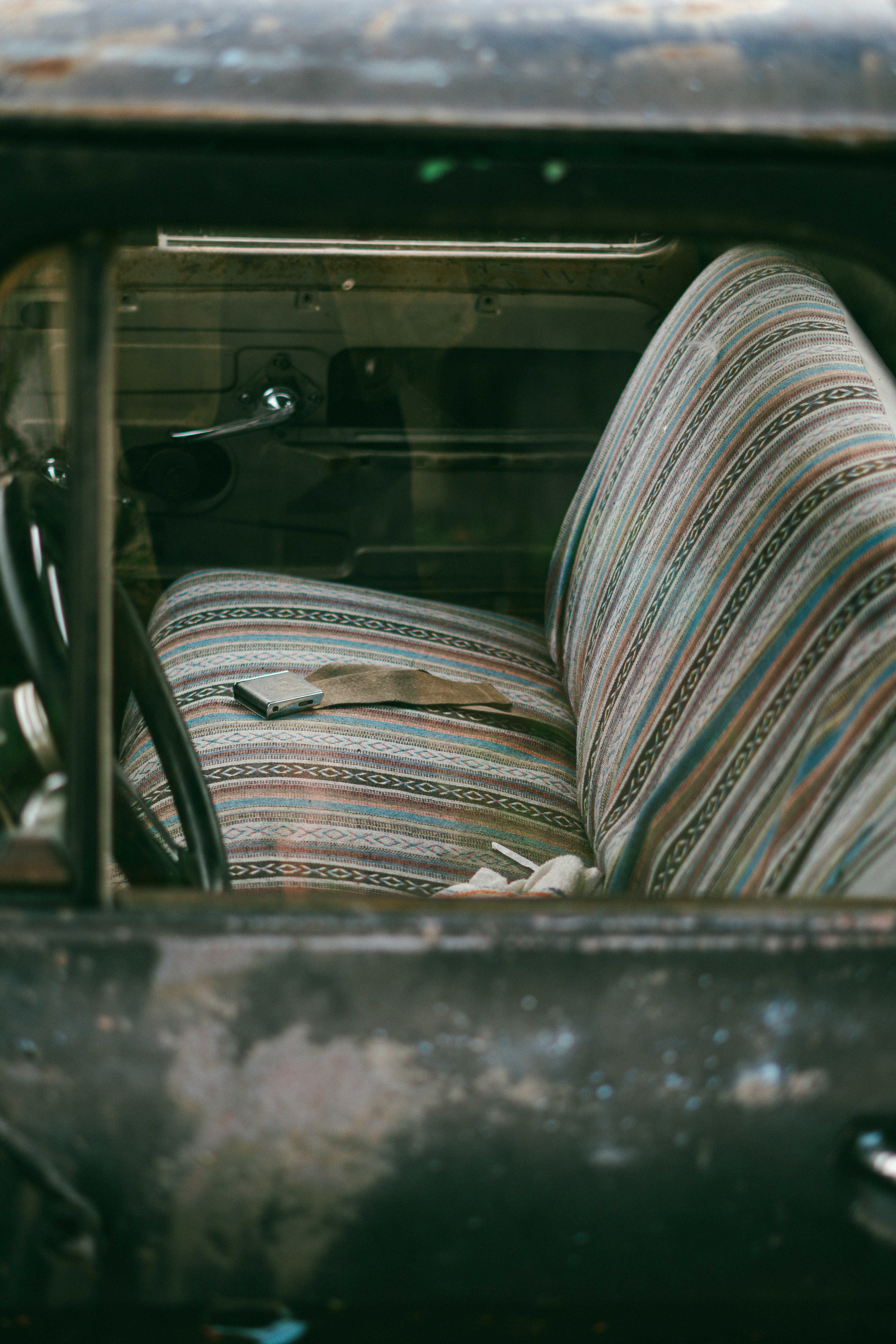 Striped Upholstery in a Timeworn Car Interior