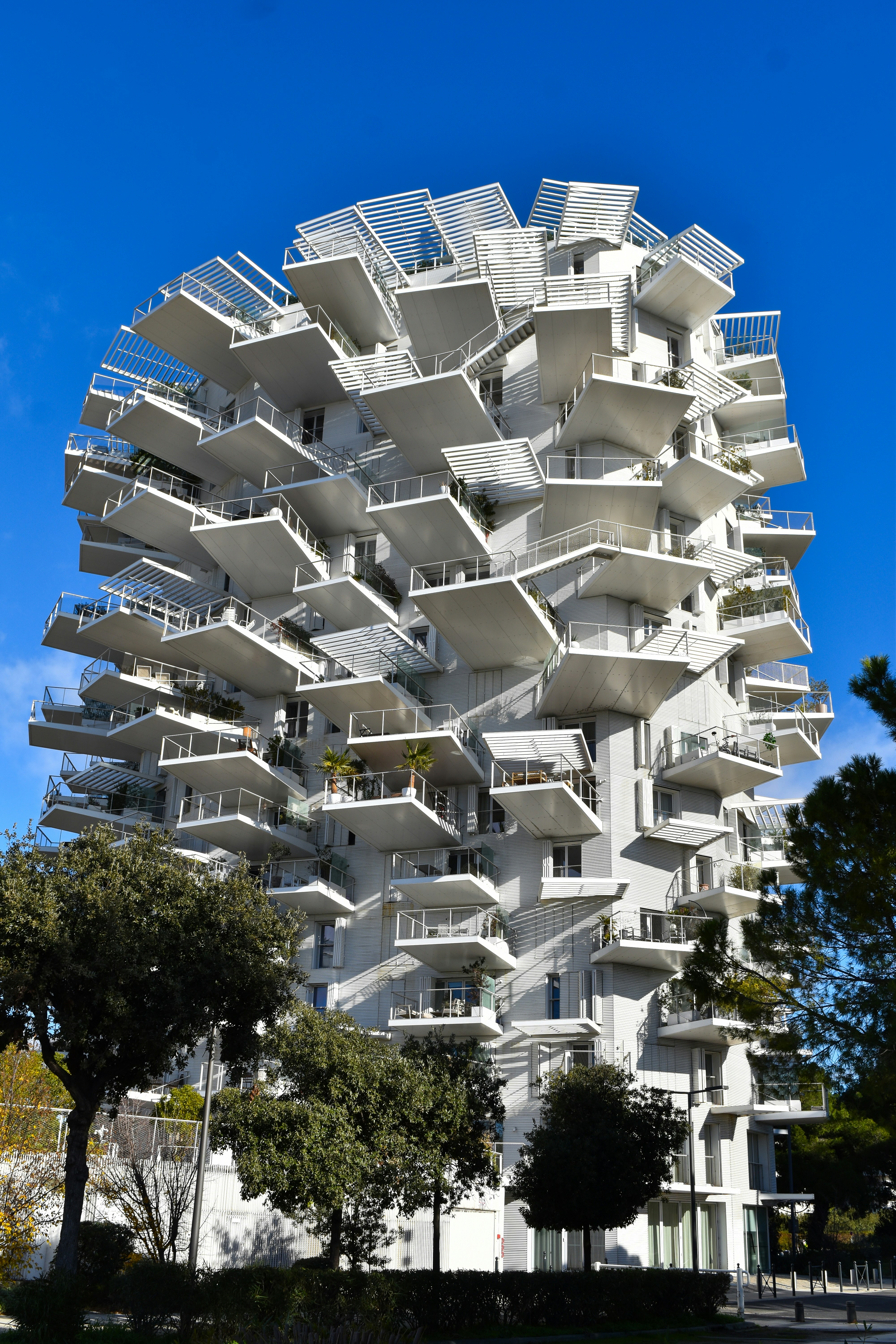 Stacked Balconies: A Concrete Spiral Reaching the Sky