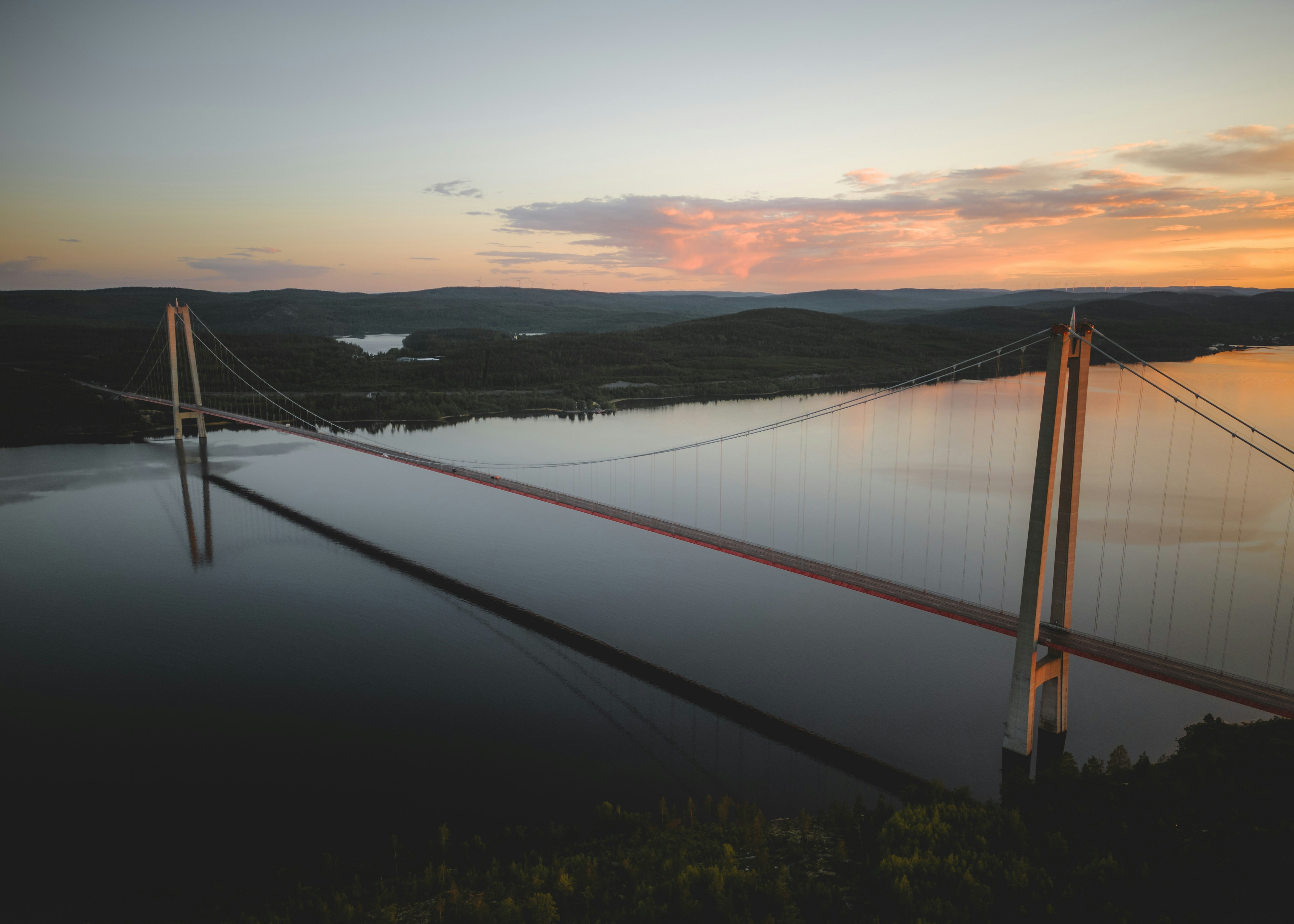 A large bridge spanning over a large body of water photo – Free High ...