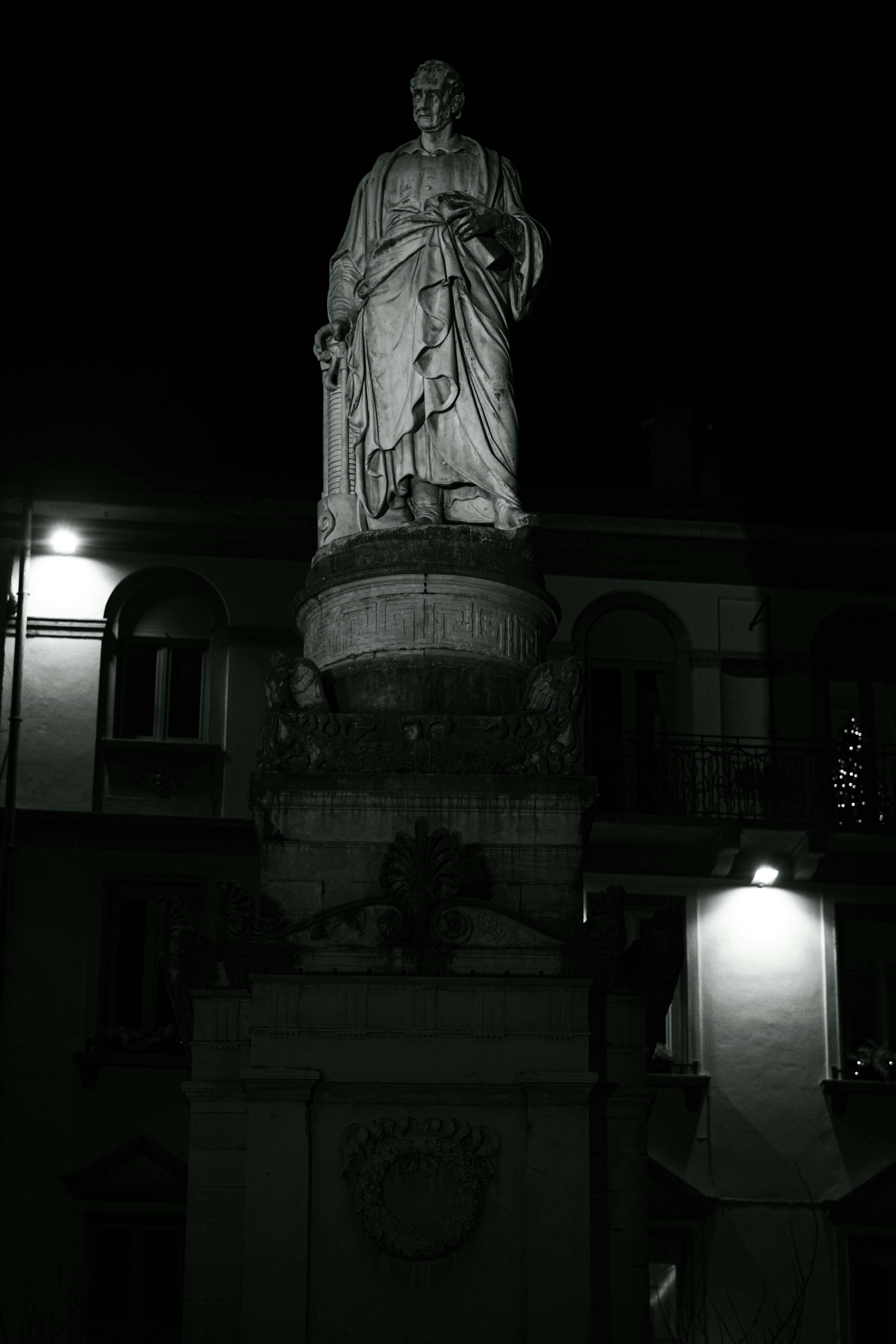 A black and white photo of a statue at night photo – Free Adult Image ...