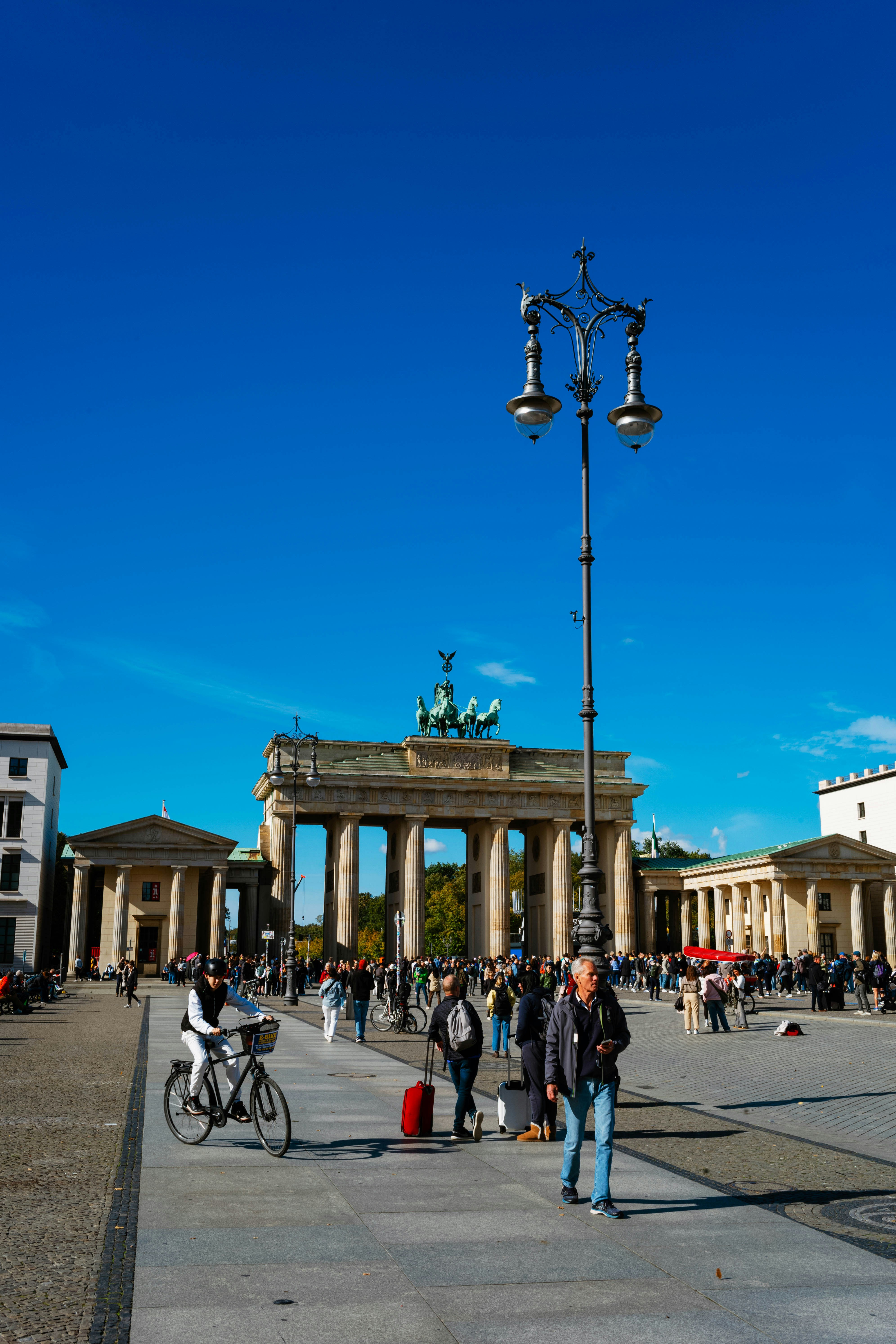 Triumphal Gate, Lamppost, and Fleet of Pedestrians at Brandenburg of Berlin