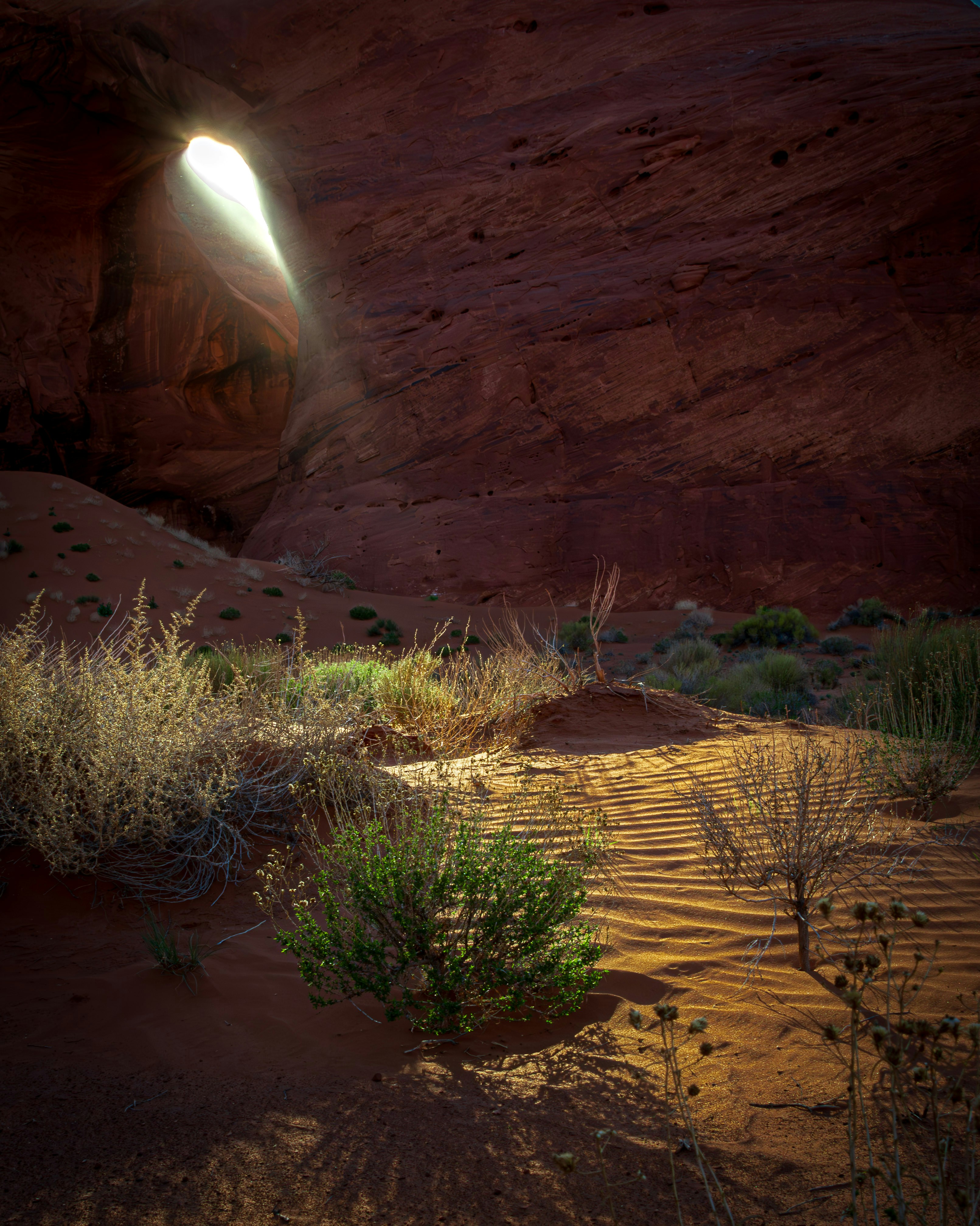 Desert Canyon Beam: A Narrow Window Illuminates Sand and Scrub