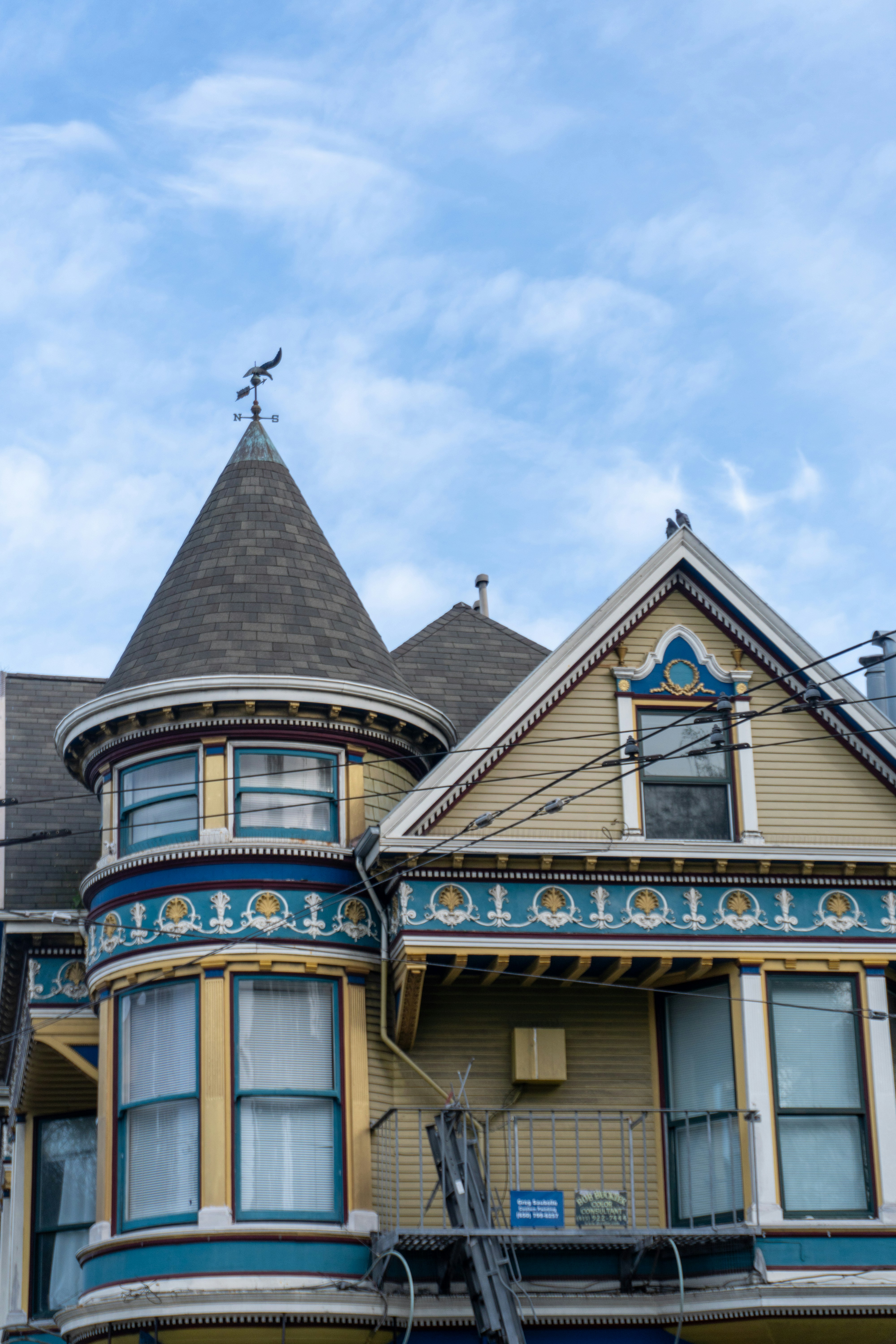A large multi - story house with a steeple on the top of it photo ...