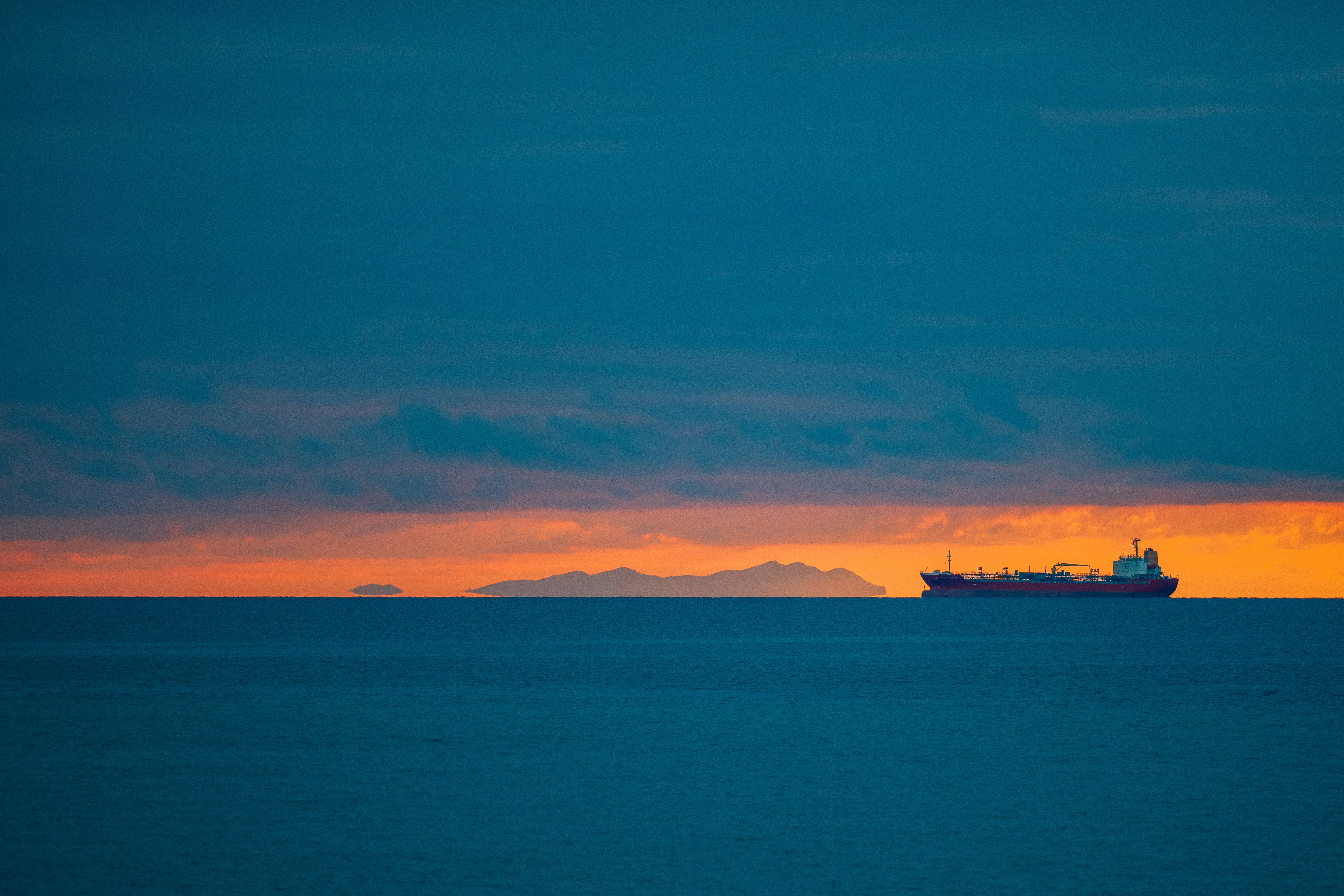 A cruise ship in the distance as the sun sets photo – Free Livorno ...