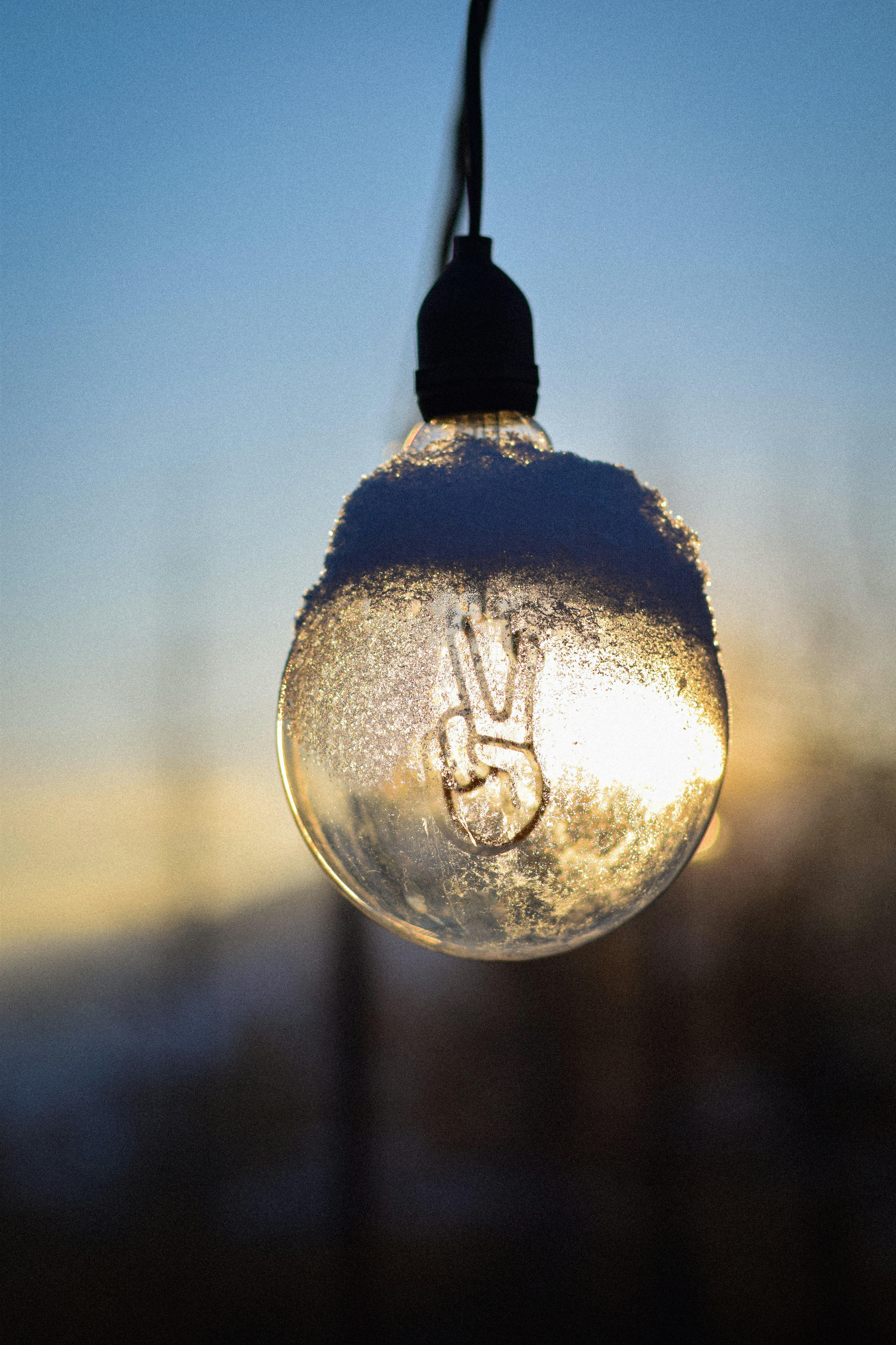 Frozen Glow: A Frosted Bulb Illuminates Dusk