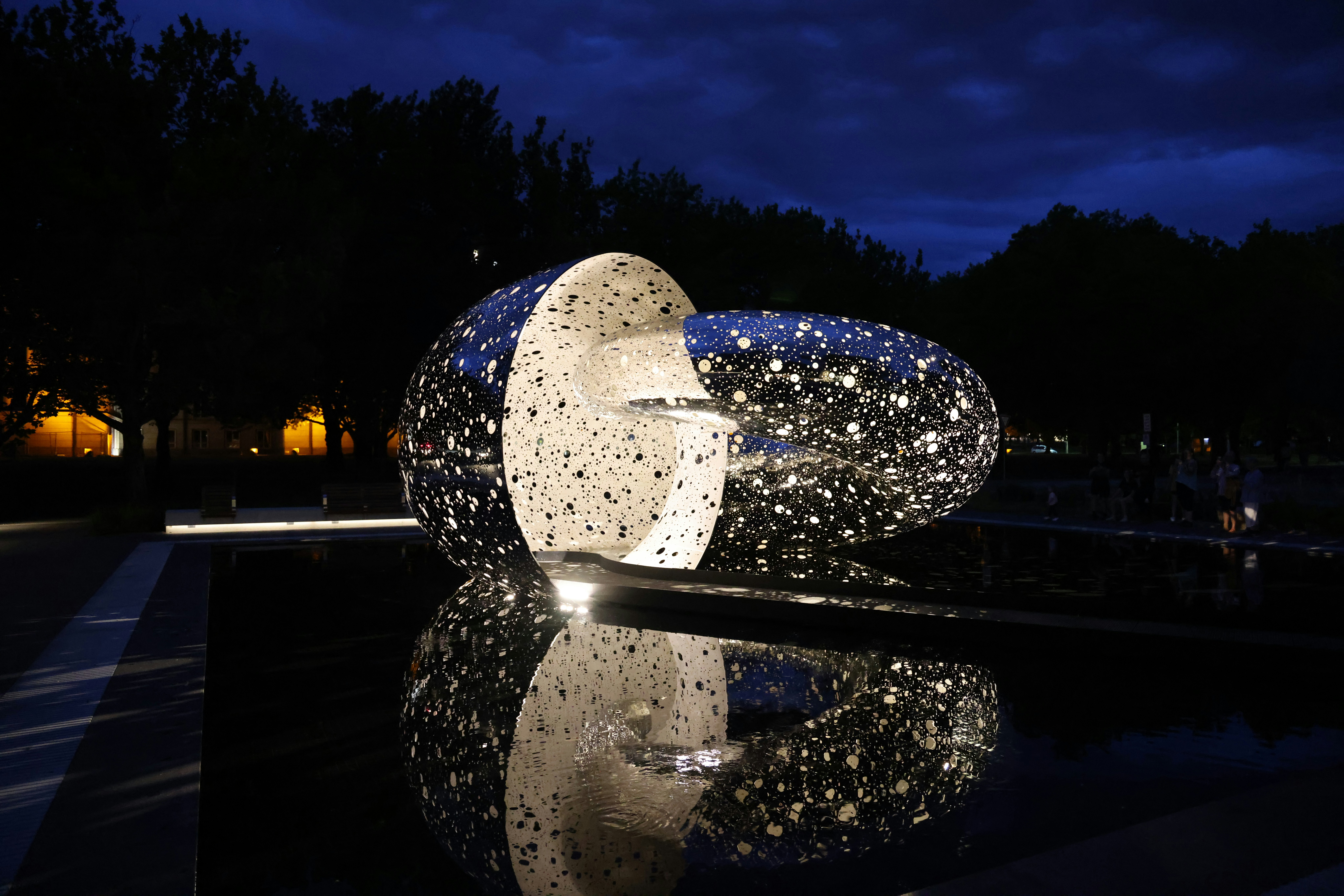 A sculpture is lit up in the dark photo – Free Canberra act Image on ...