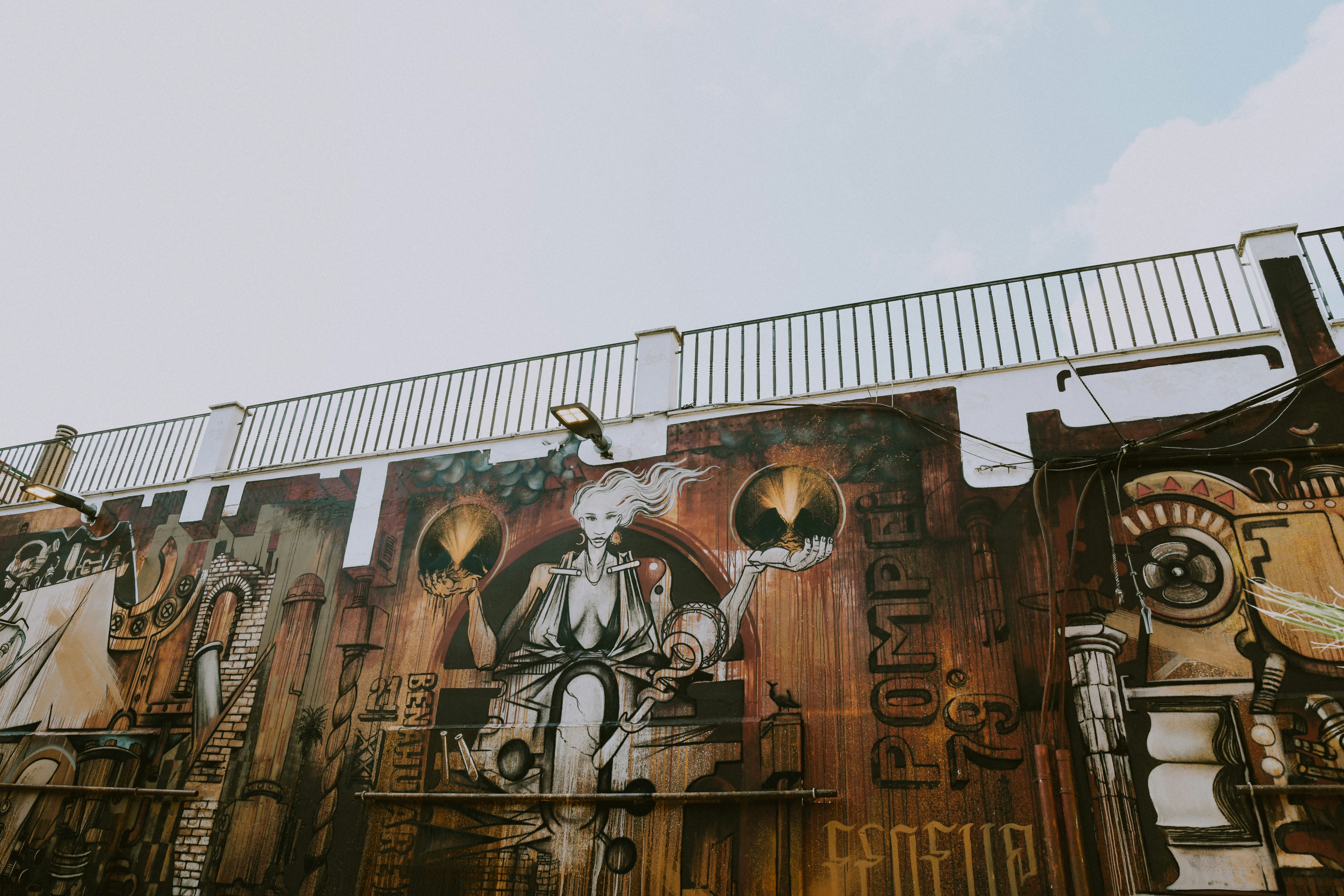 Gearwork Graffiti: Skeletons and Steam on a Brick Canvas