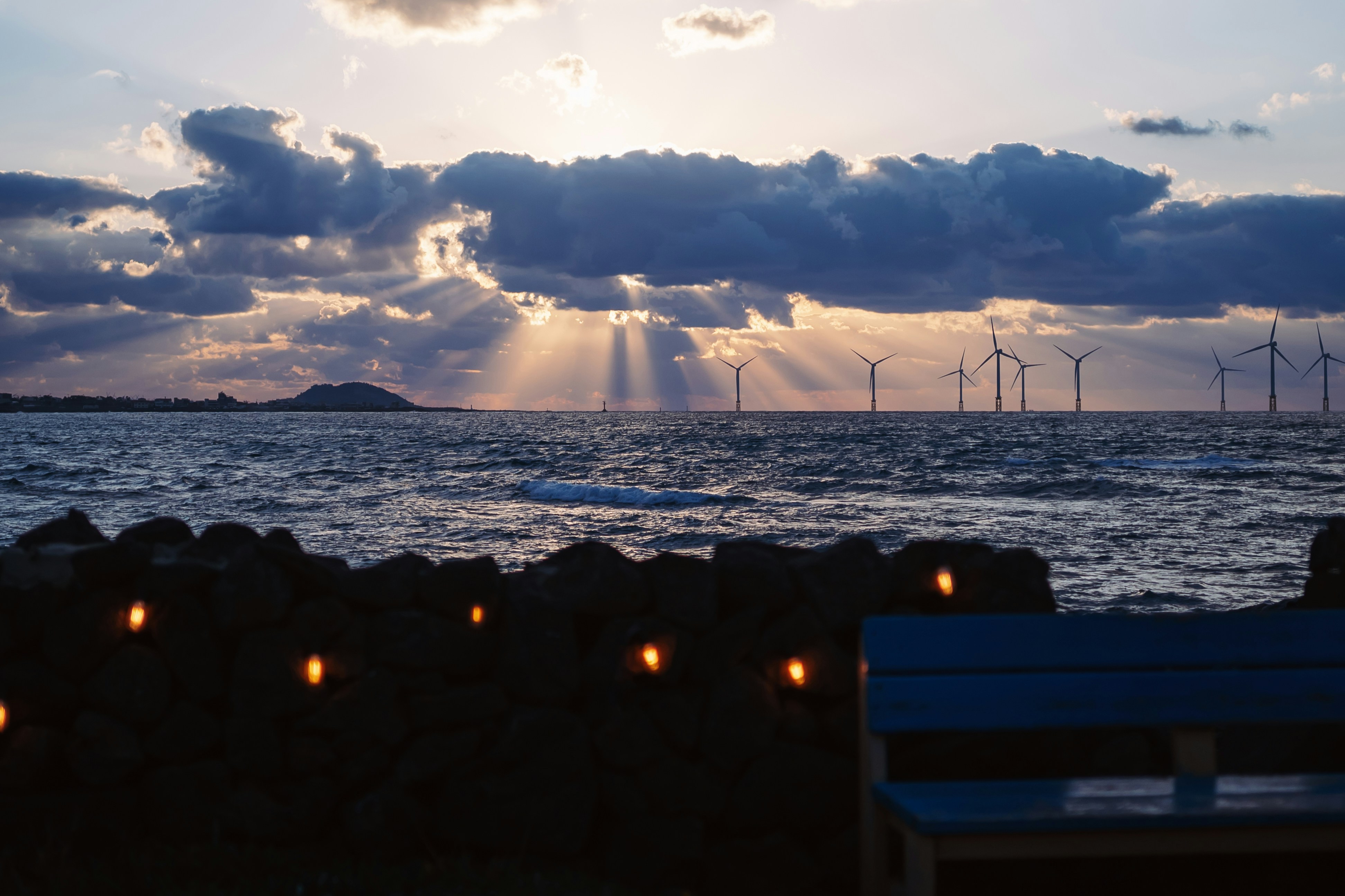 Dusk Rays Over a Wind-Turbine Horizon