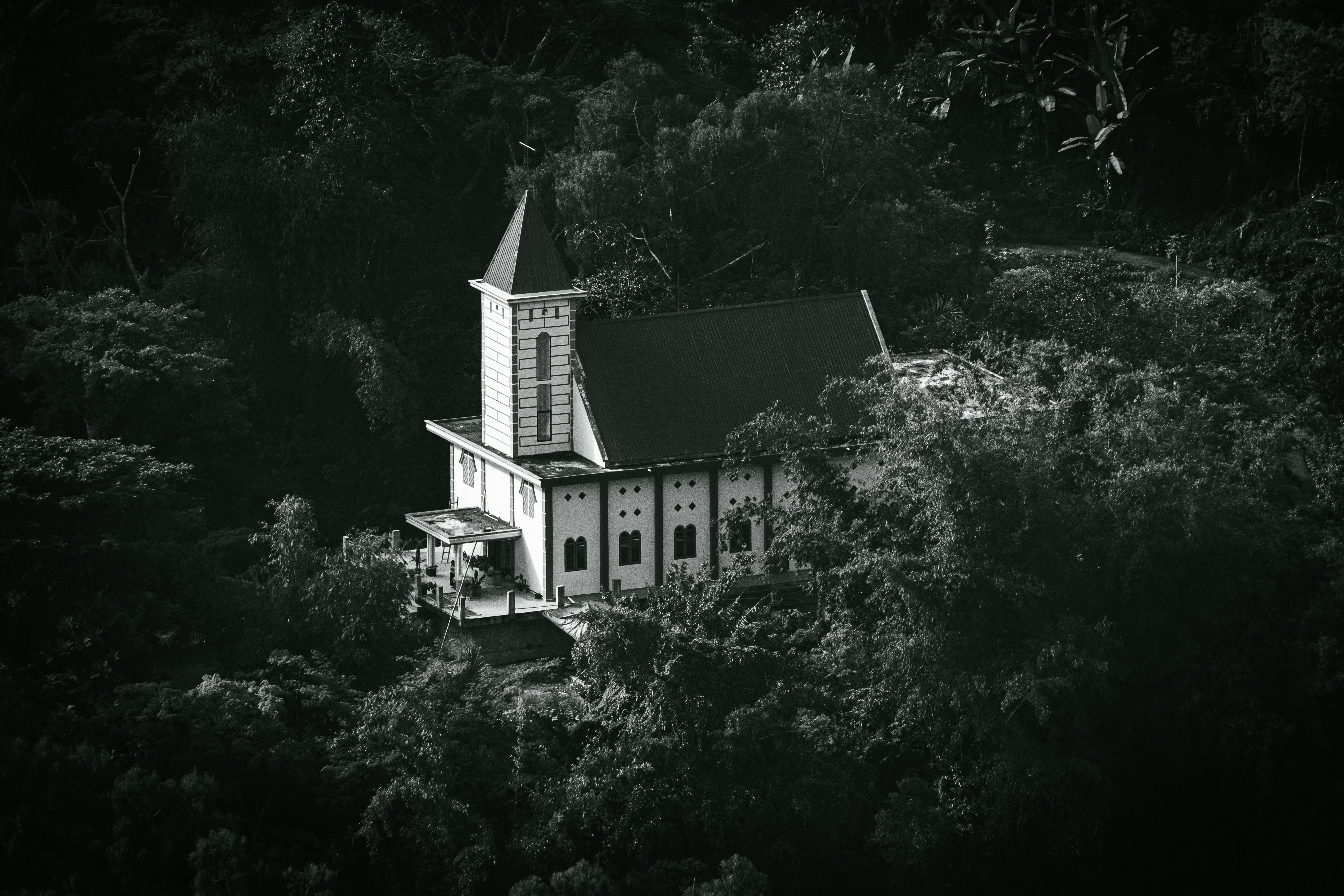 Forest Church | A black and white photo of a church on a hill