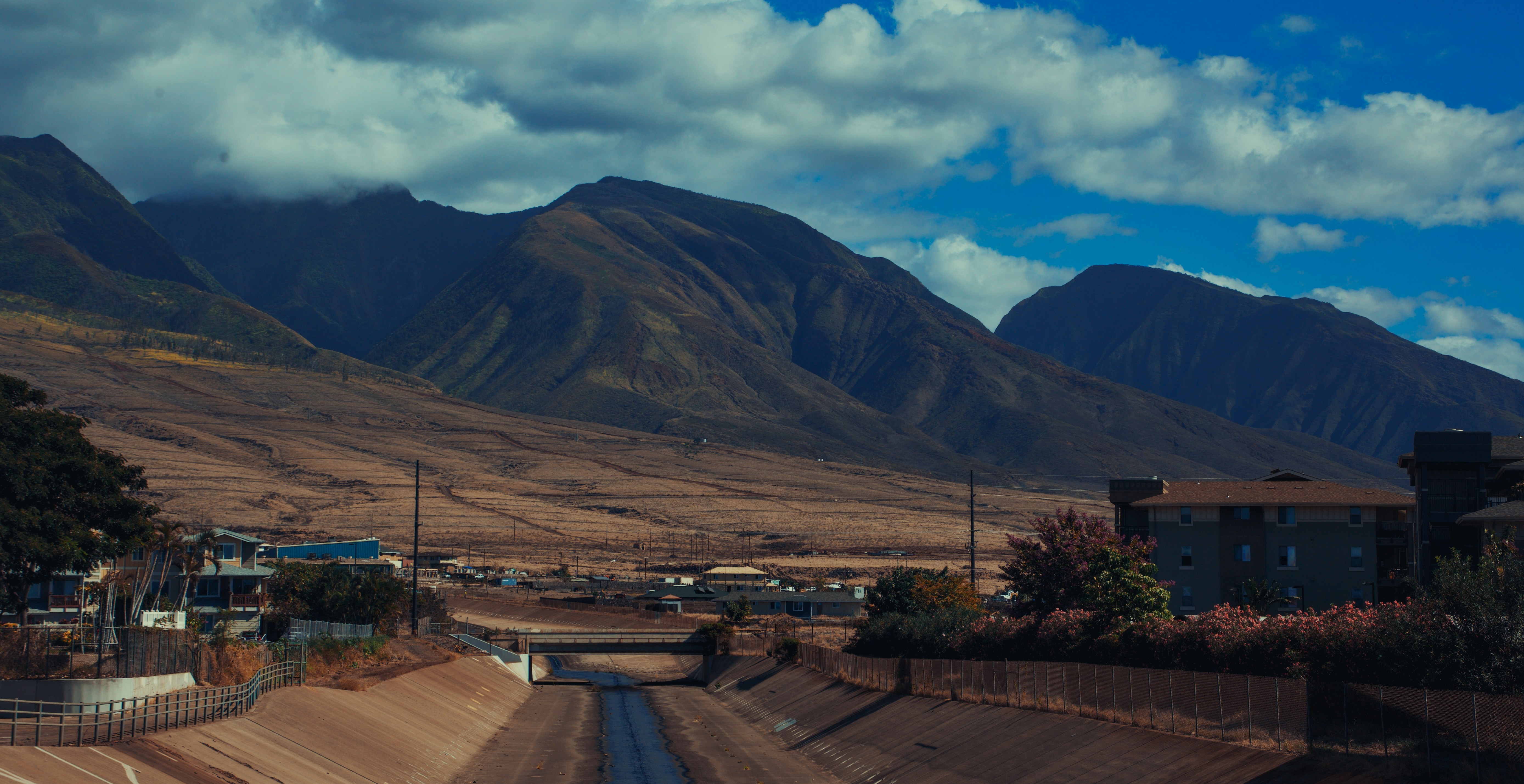 Canal Convergence: A Quiet Town Fronting Rugged Peaks