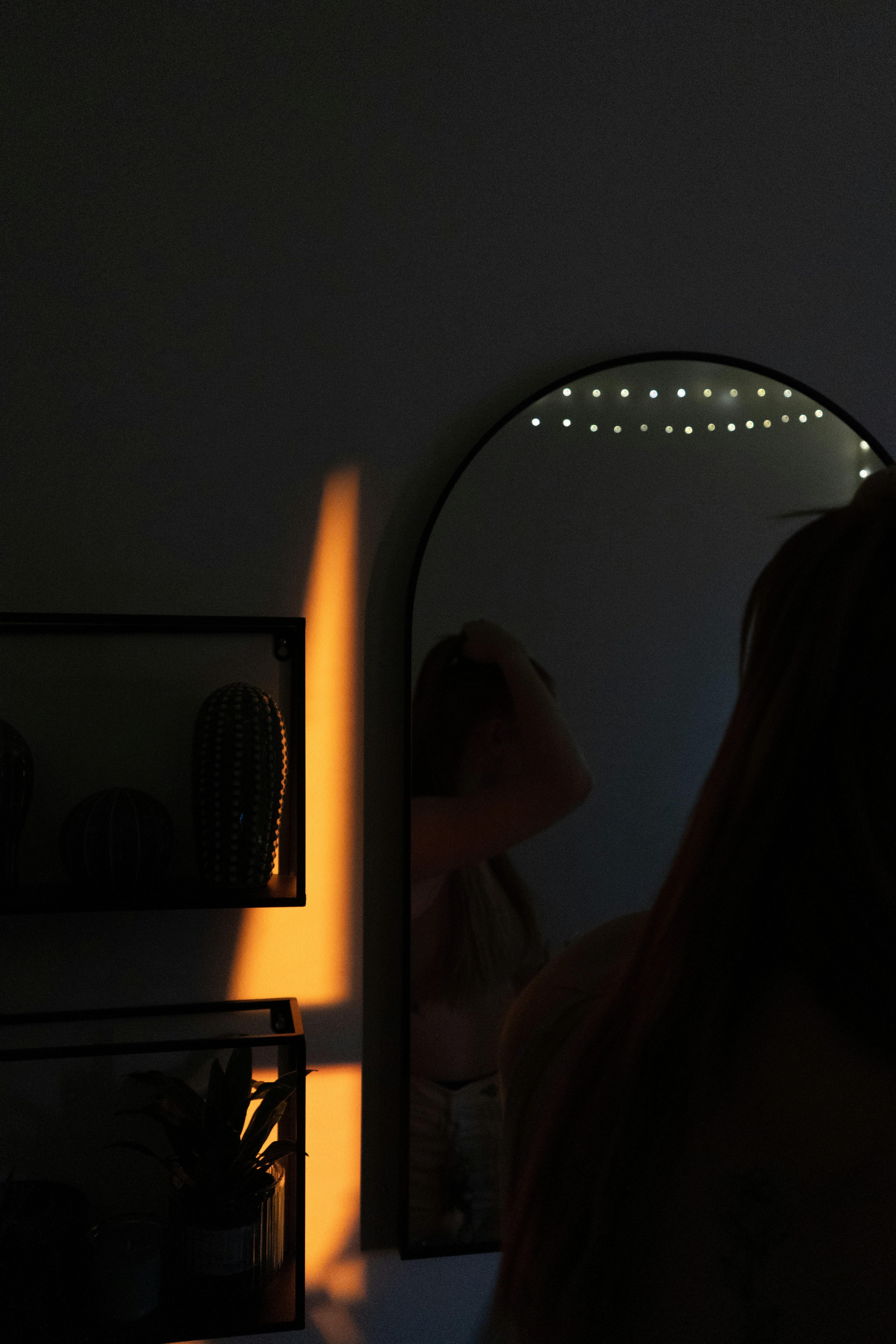 Edge of Warm Light: Round Mirror and Quiet Corner