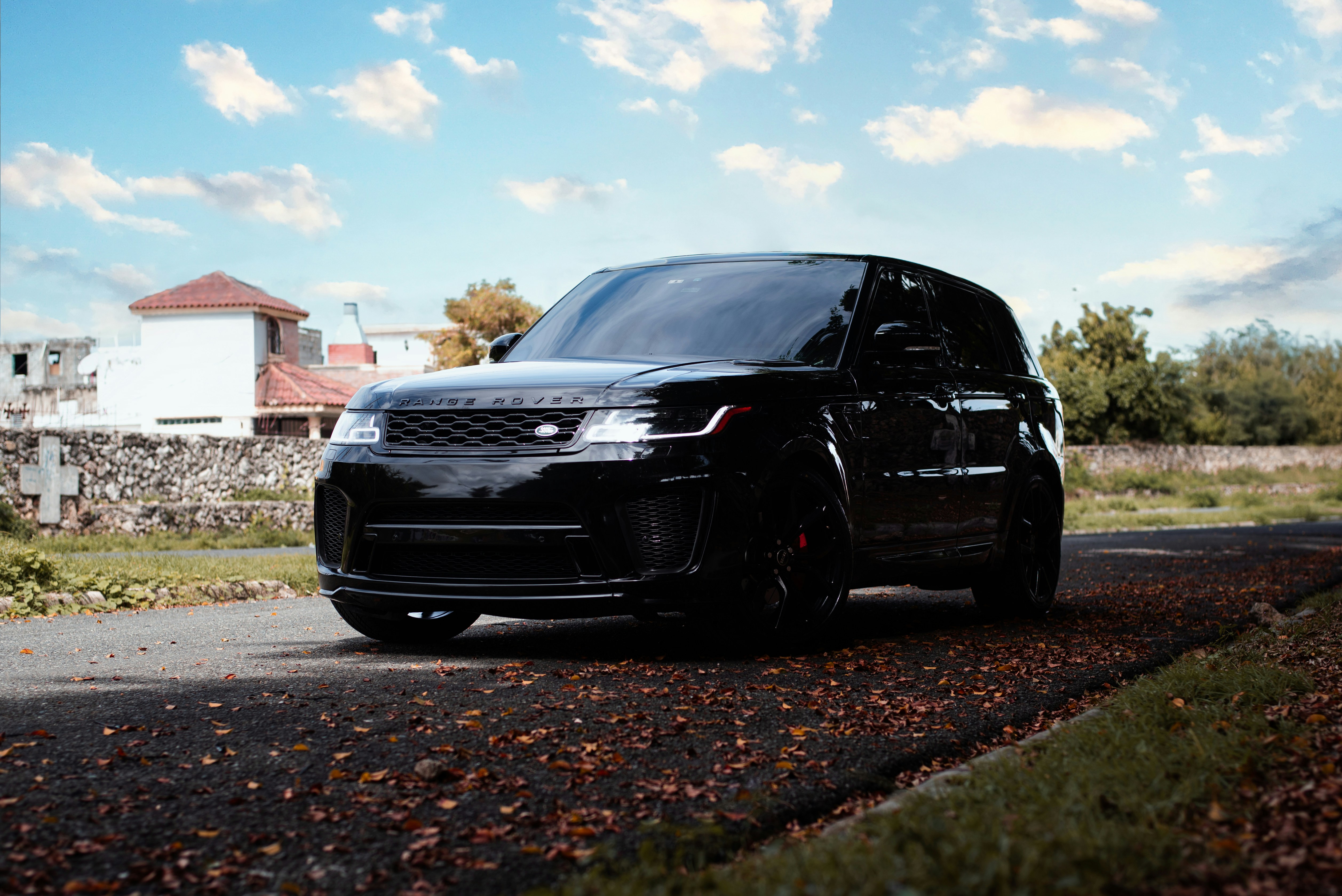 A black range rover parked on the side of the road photo – Free ...